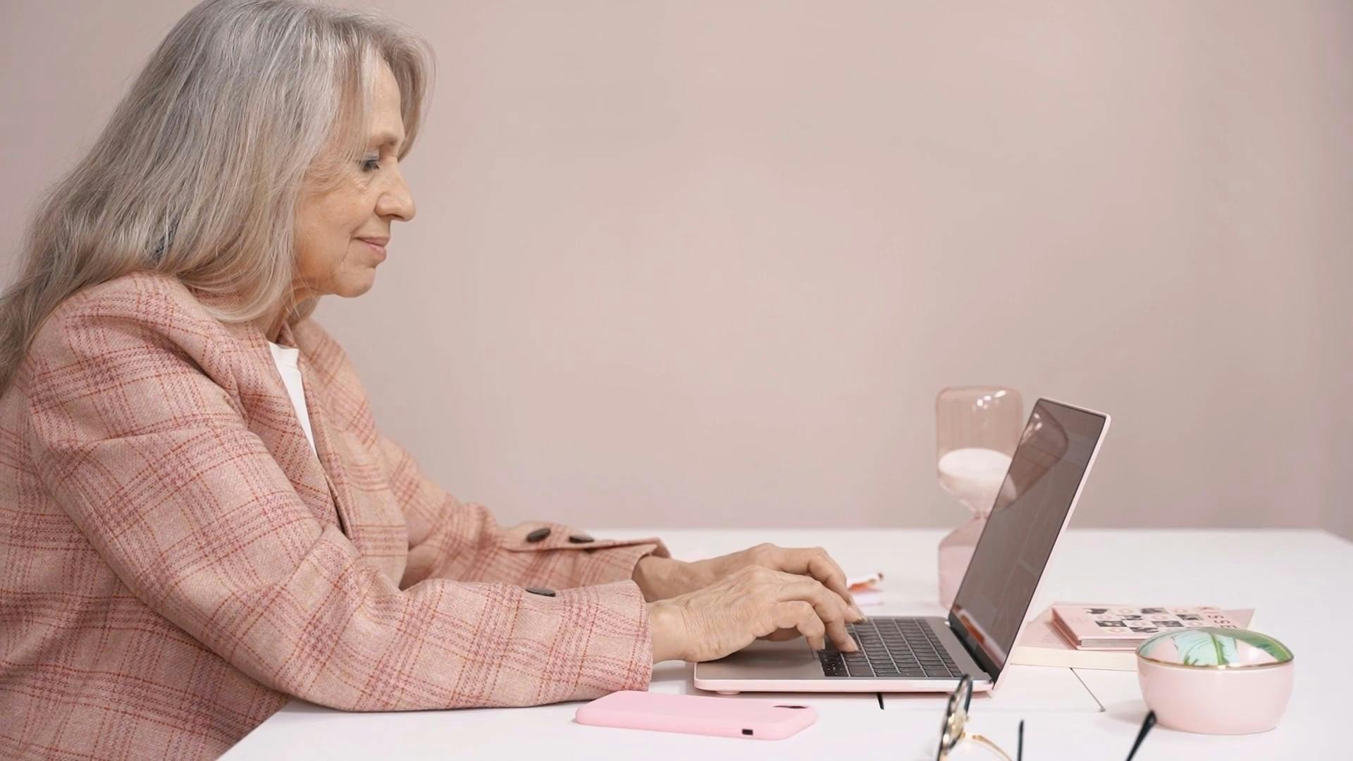 Elderly Woman Using a Laptop · Free Stock Video