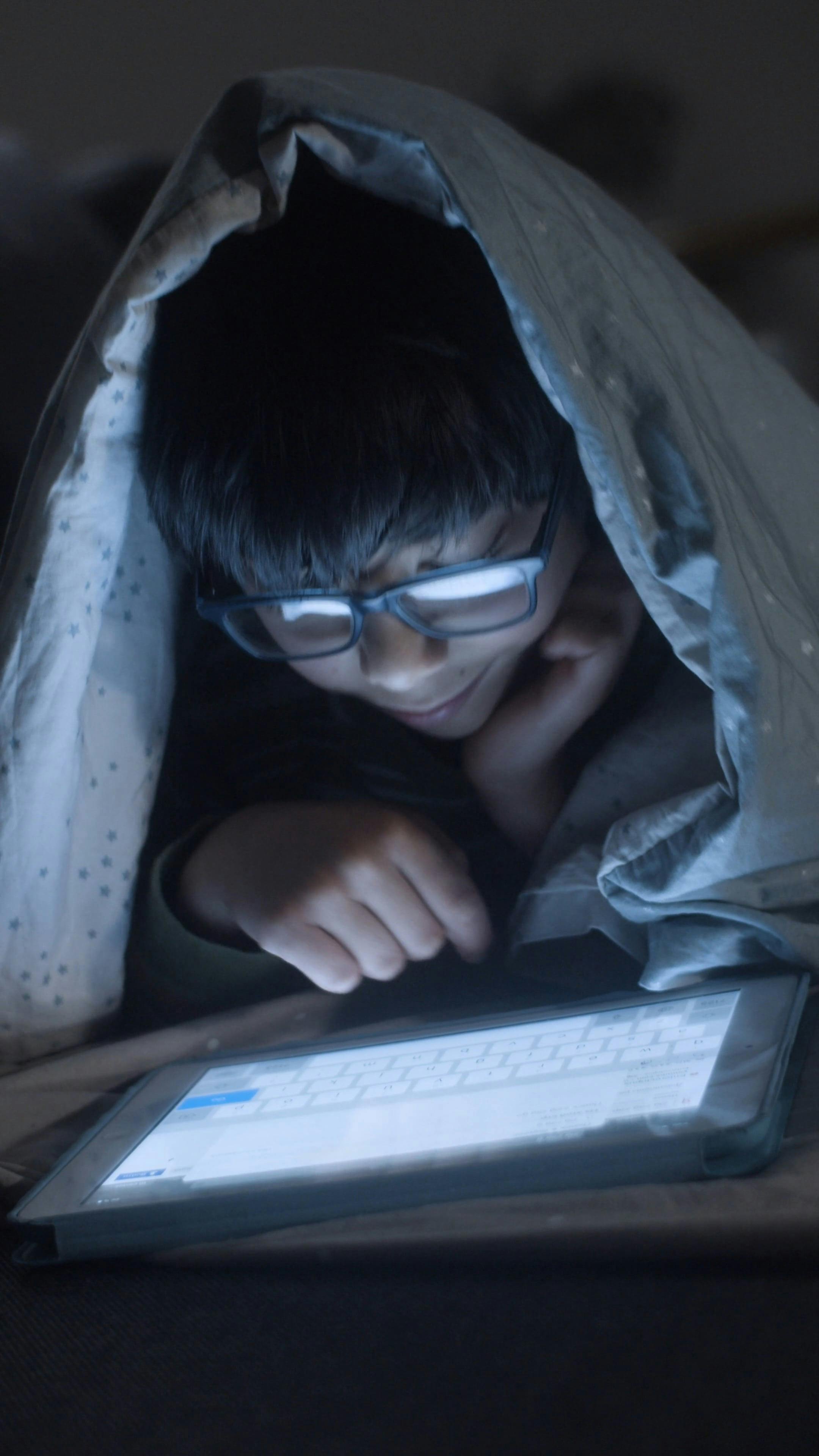 A Boy Typing on a Tablet · Free Stock Video