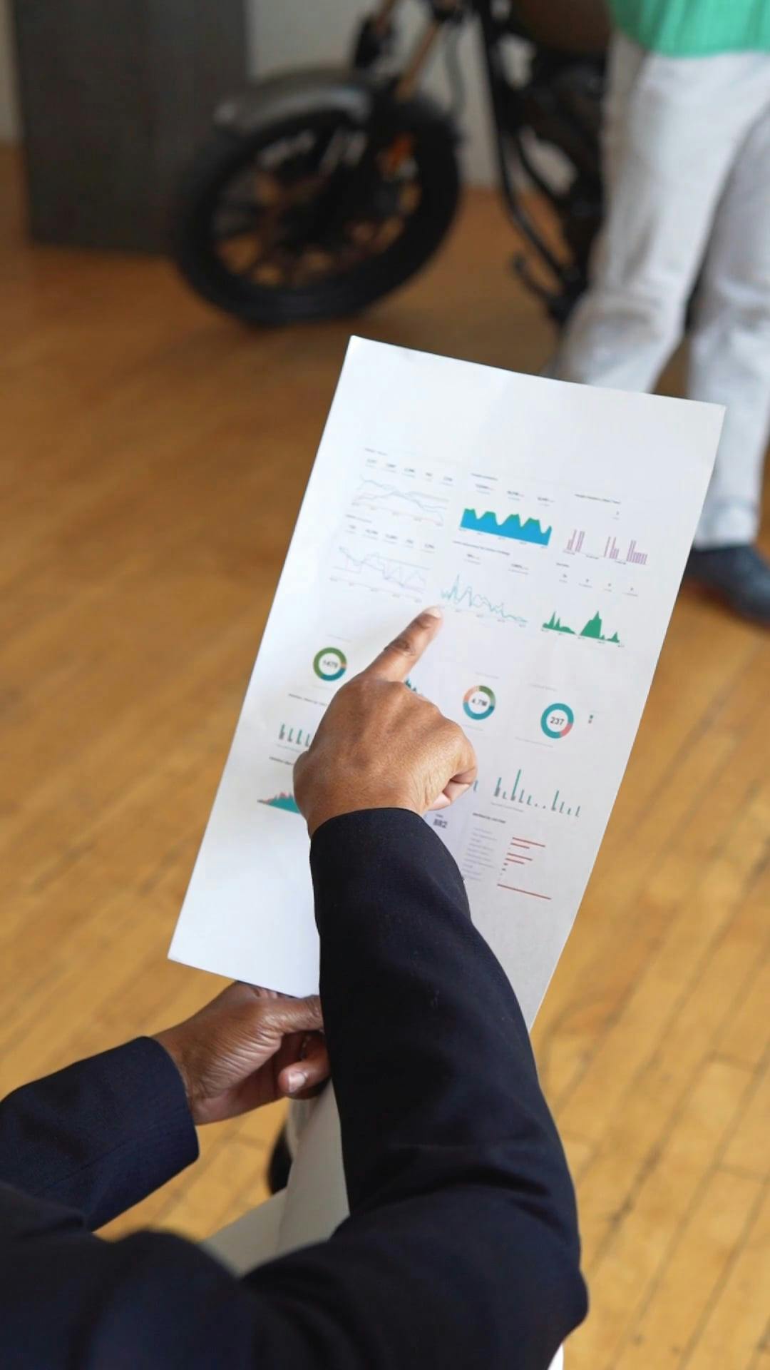 Close Up View of a Man Pointing on a Paper While Talking to Someone ...