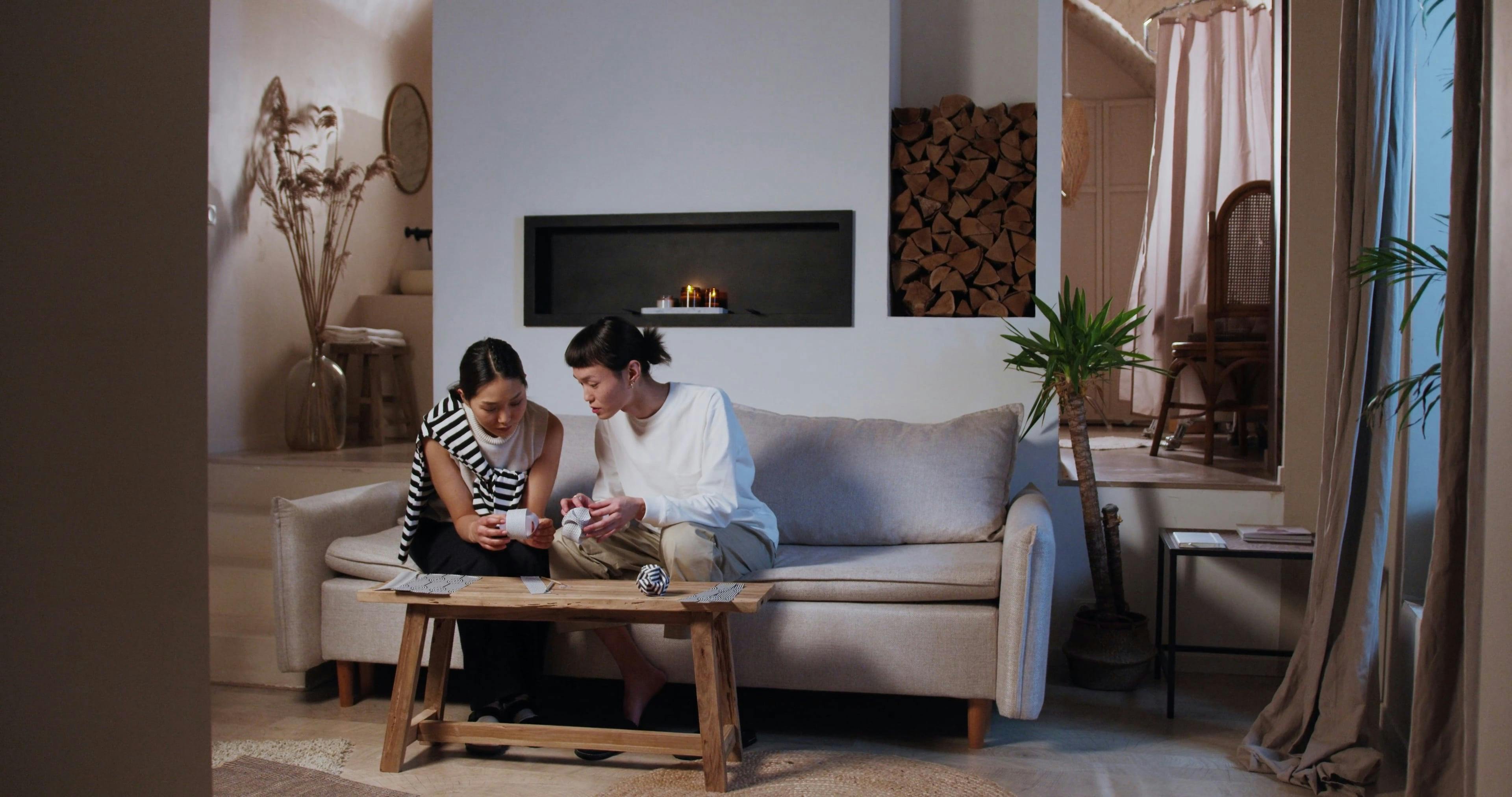 Man and Woman Bonding Over Paper Cutouts Free Stock Video Footage ...