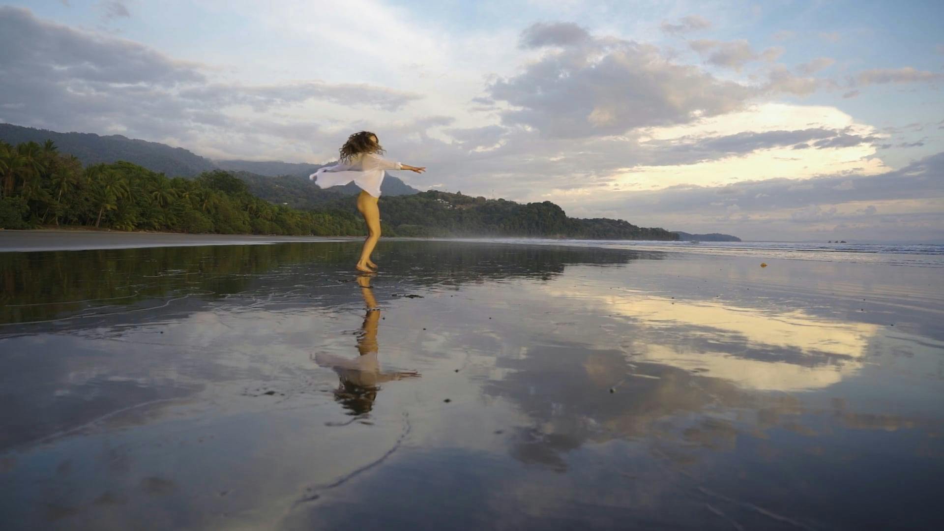Woman in Bathing Suit while Spinning Around the Shoreline · Free Stock ...