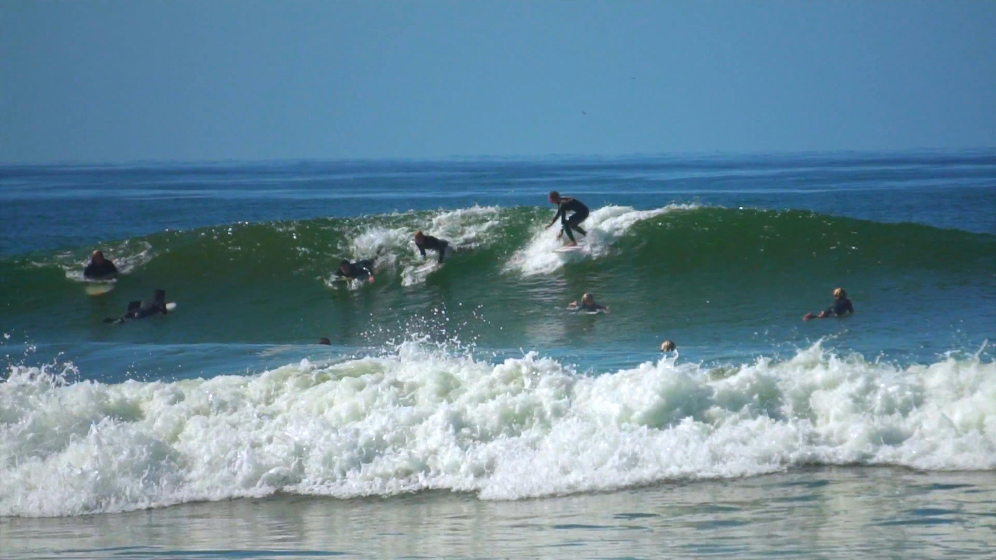 Surfers Riding the Waves · Free Stock Video