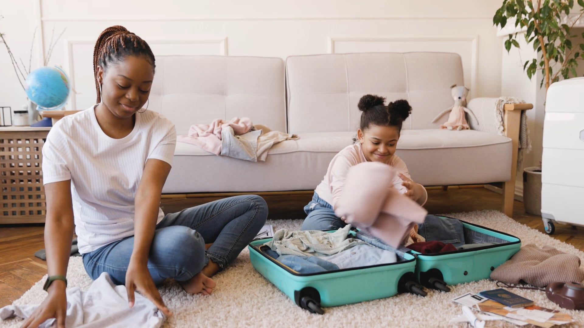 Mother and Daughter Packing Clothes in the Luggage Free Stock Video ...