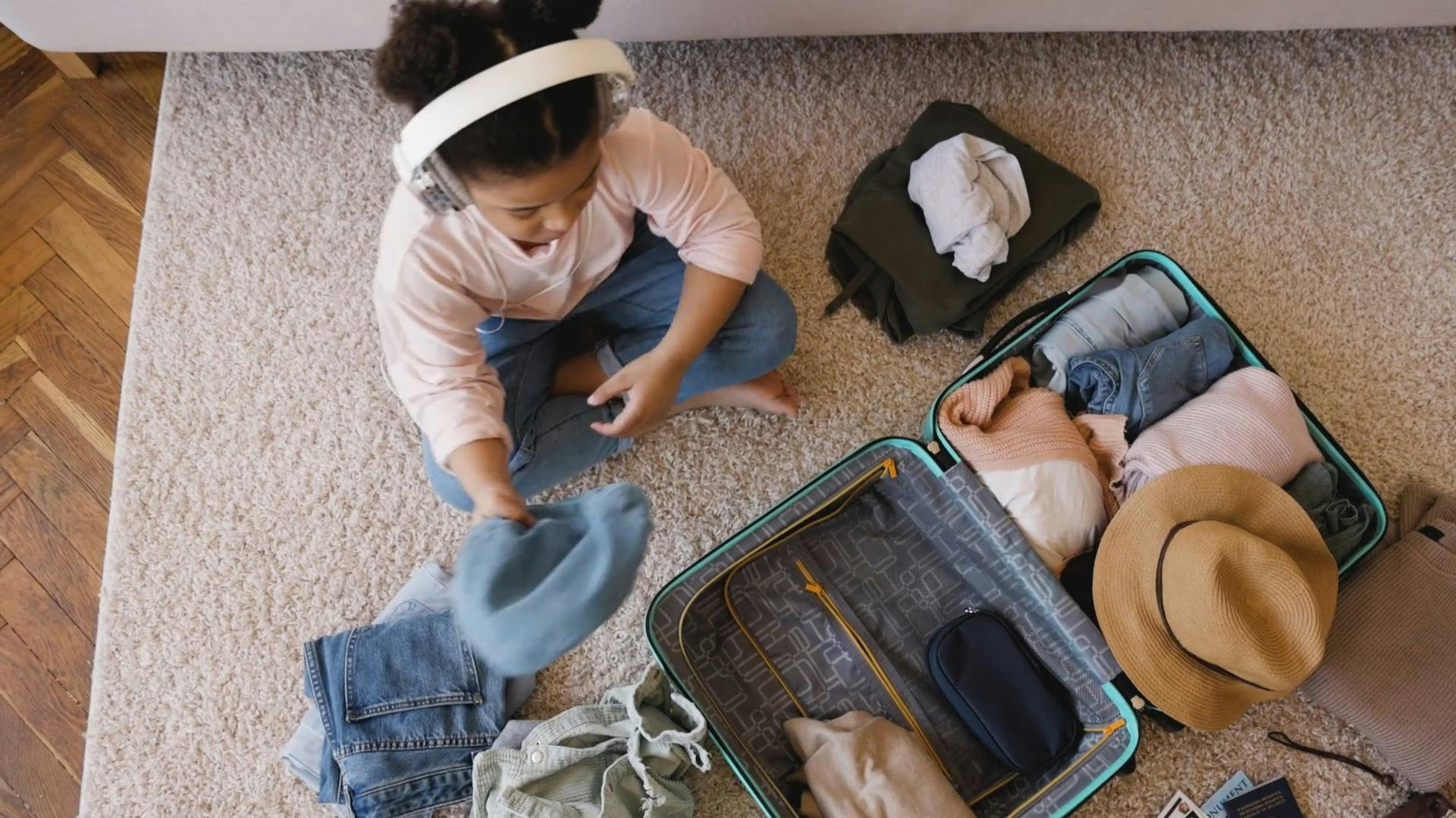 Overhead Shot of a Girl Packing a Suitcase Free Stock Video Footage ...