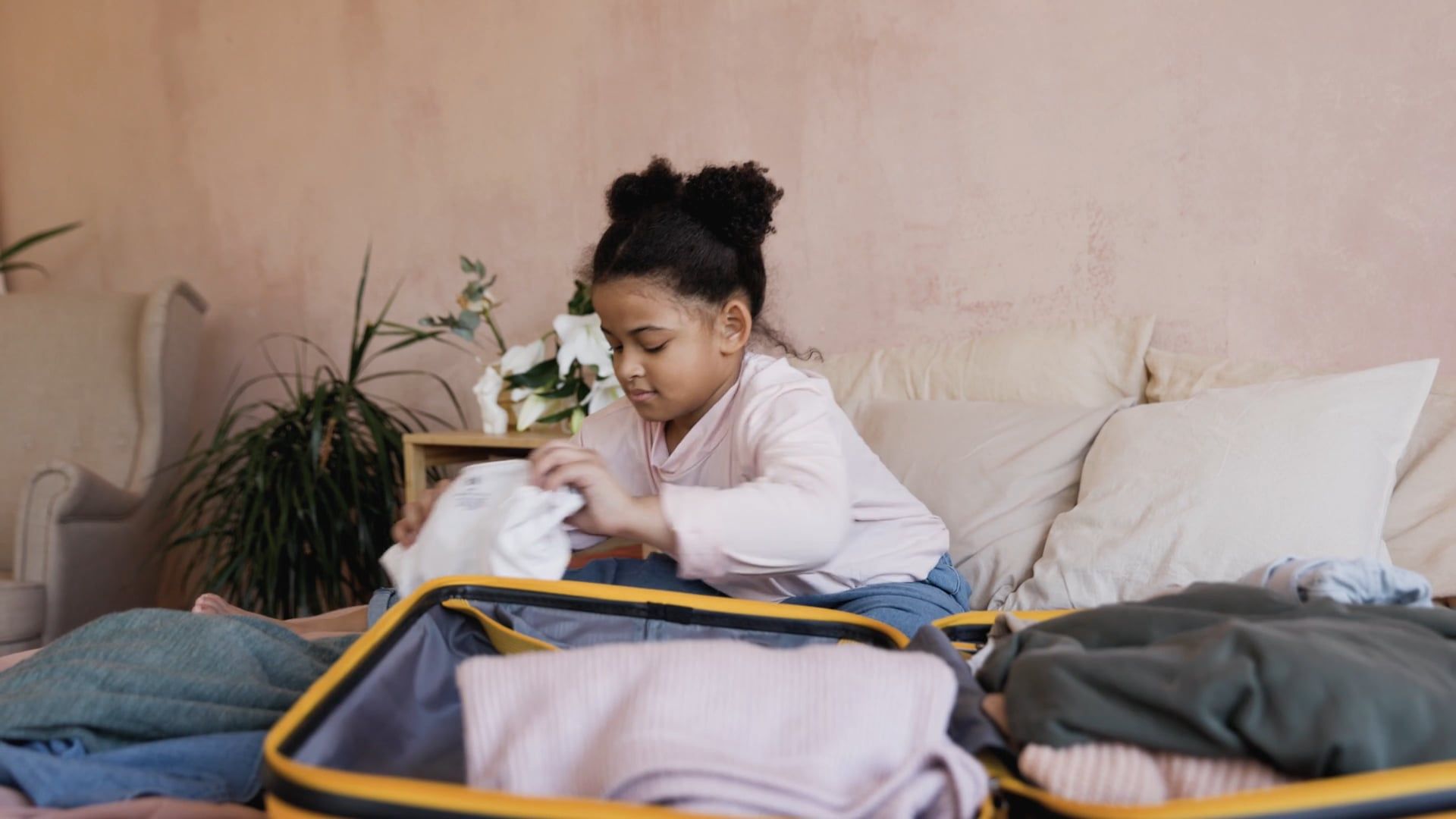 A Young Girl Packing Her Clothes · Free Stock Video