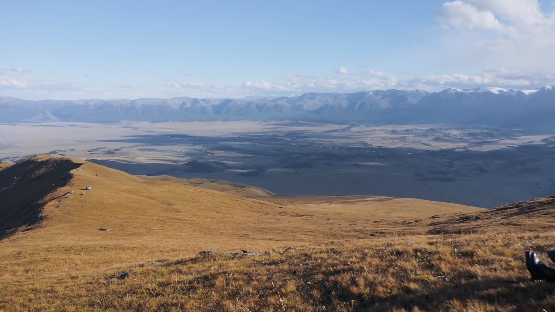Person On A Cliff Overlooking The Mountains · Free Stock Video
