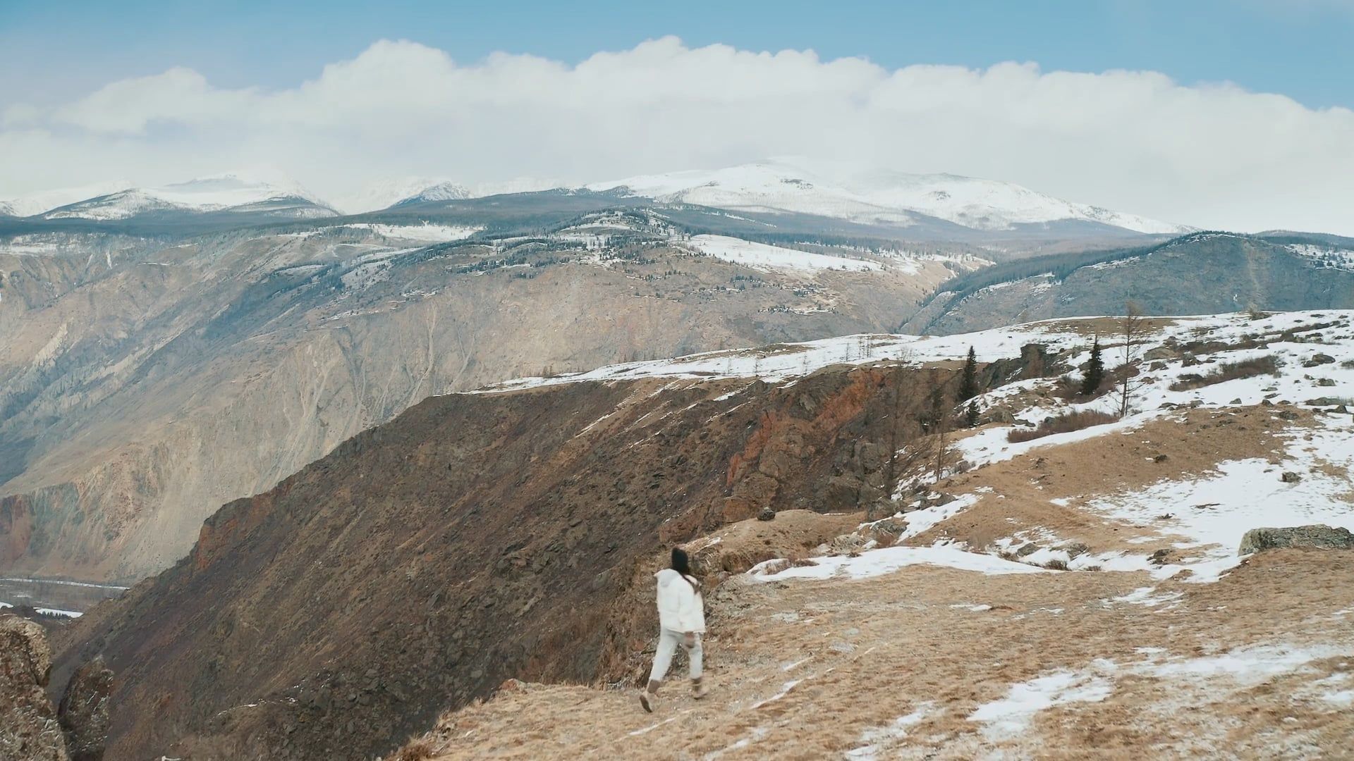 Aerial Shot of a Woman Running on a Cliff of a Mountain Free Stock ...