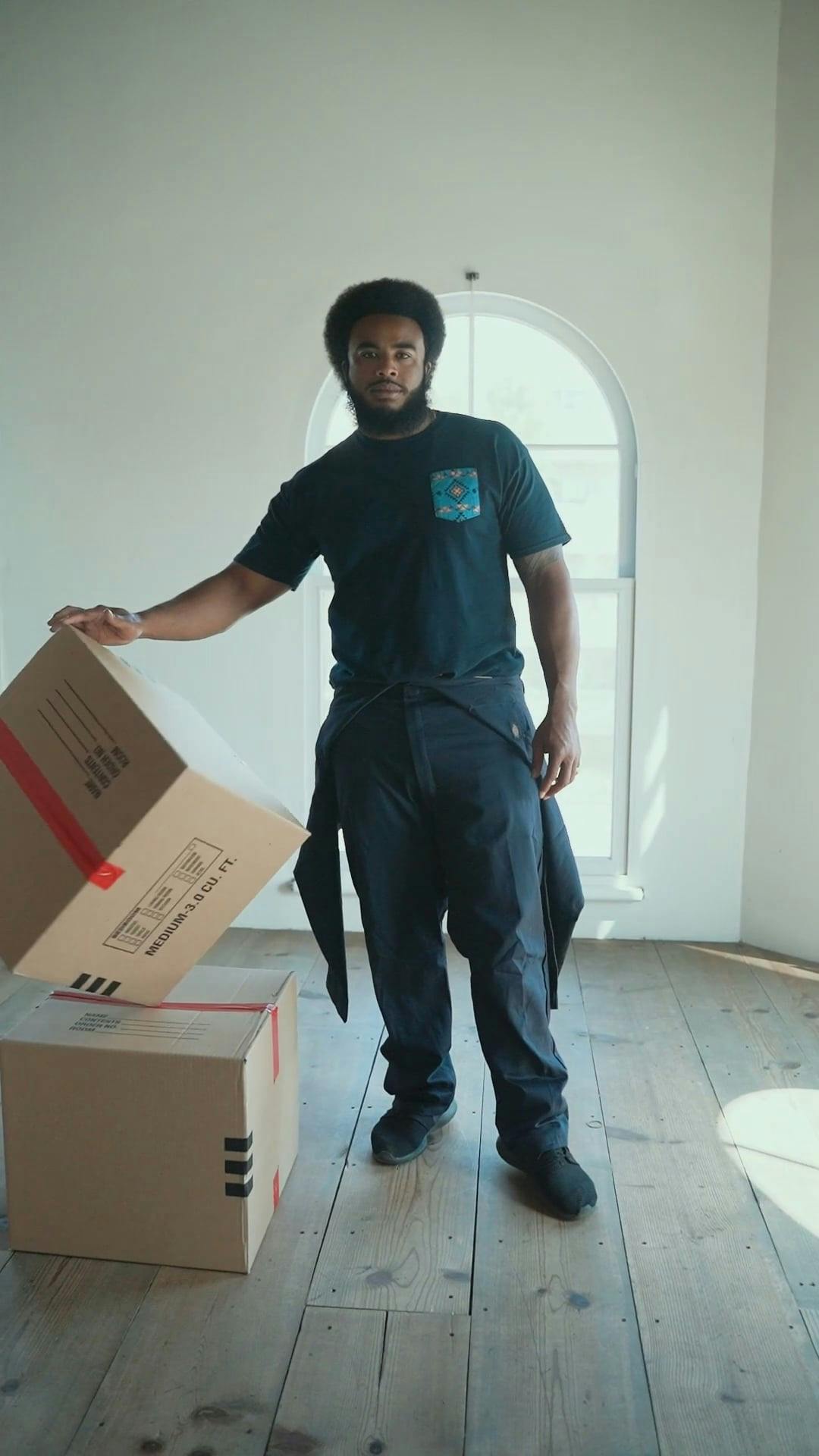 A Man Hesitantly Gives Up His Digital Video Disks Collection By Packing ...
