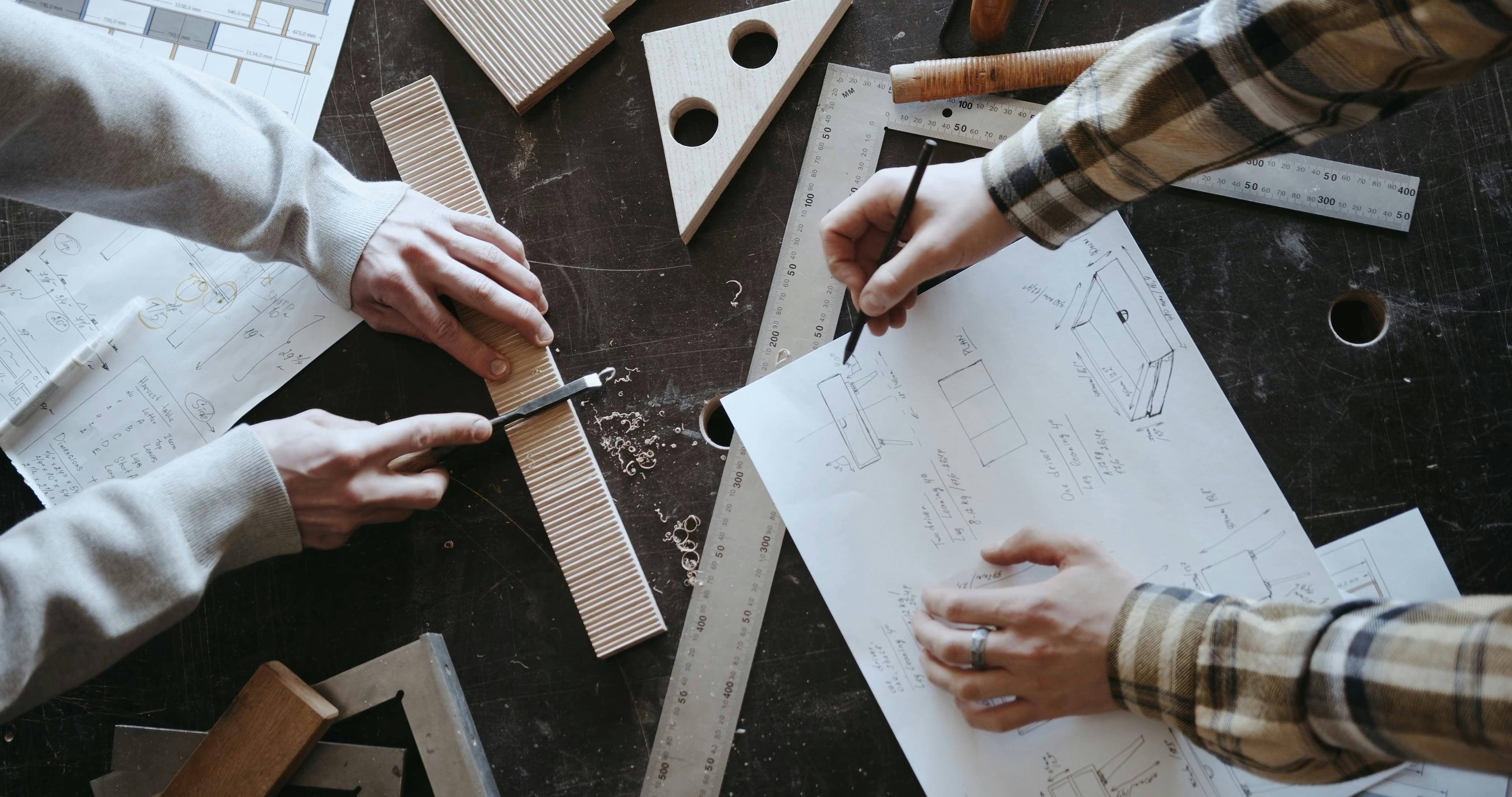 A Person Writing on the Blueprint · Free Stock Video