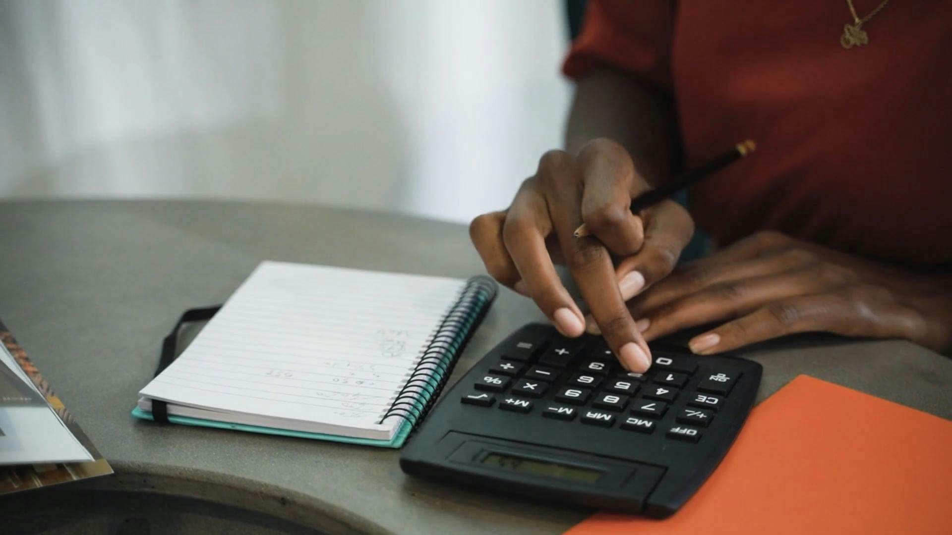 Person Using a Calculator · Free Stock Video