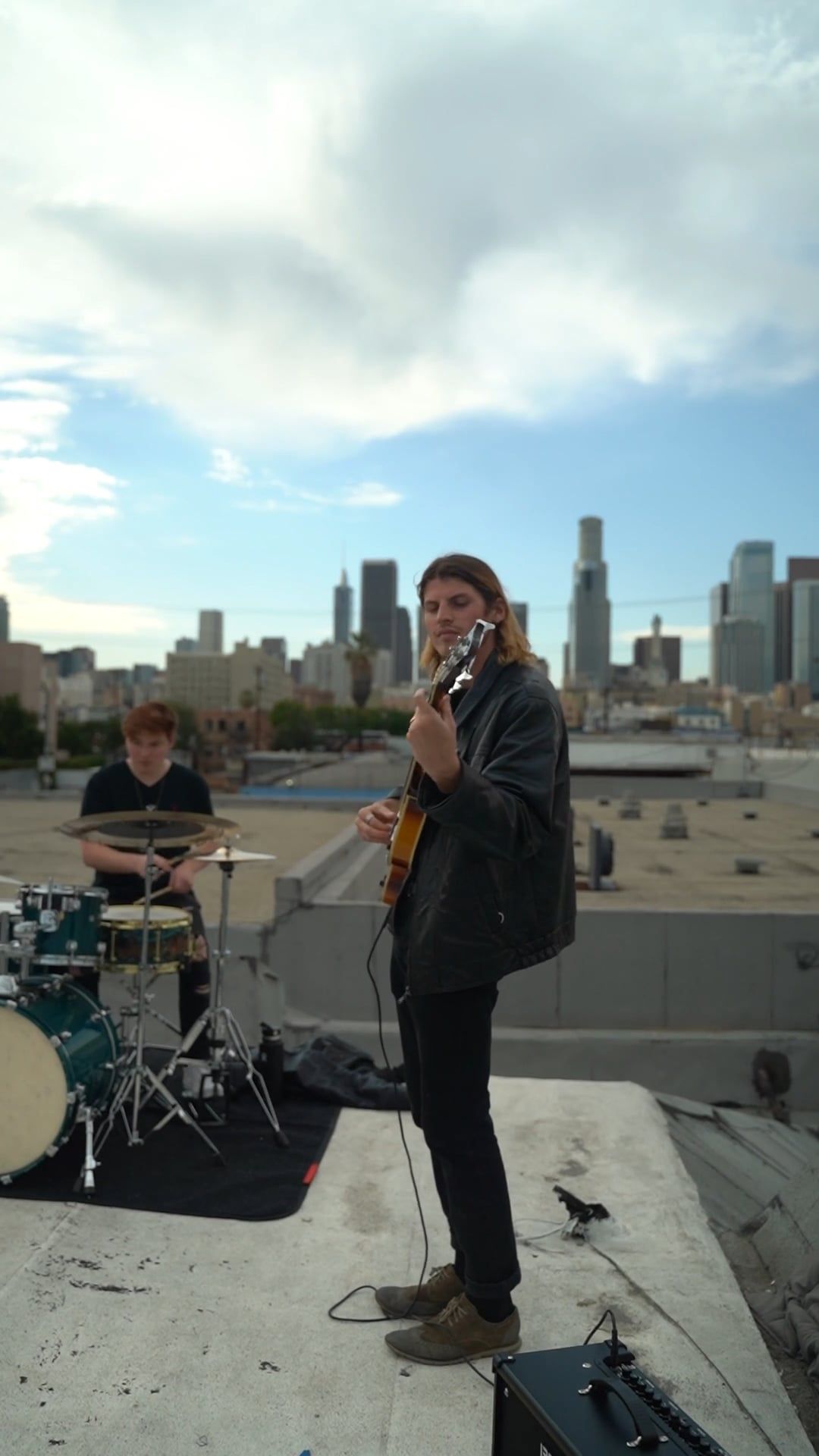 A Man Playing the Bass Guitar on a Rooftop Free Stock Video Footage ...