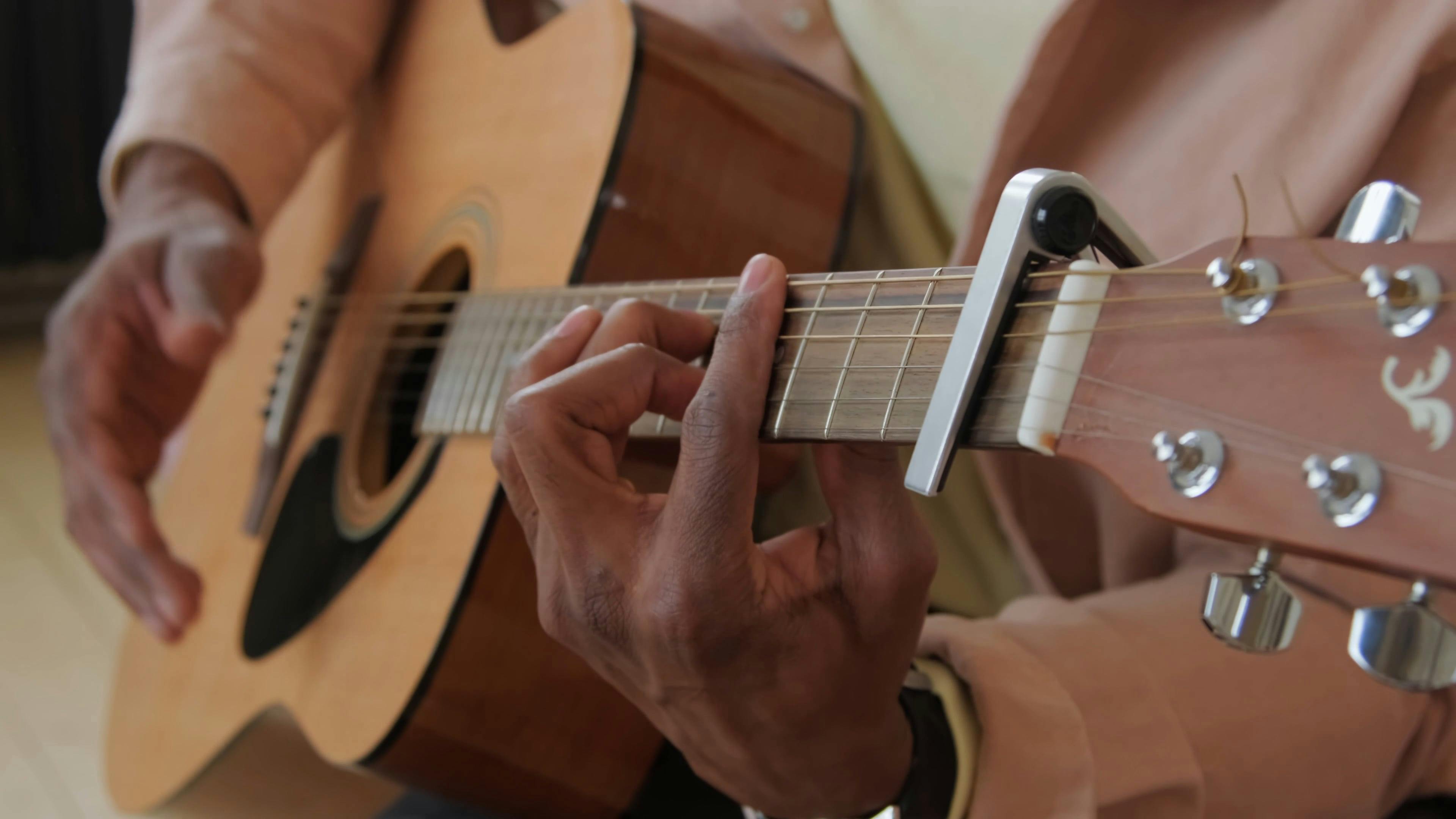 A Person Playing the Acoustic Guitar · Free Stock Video