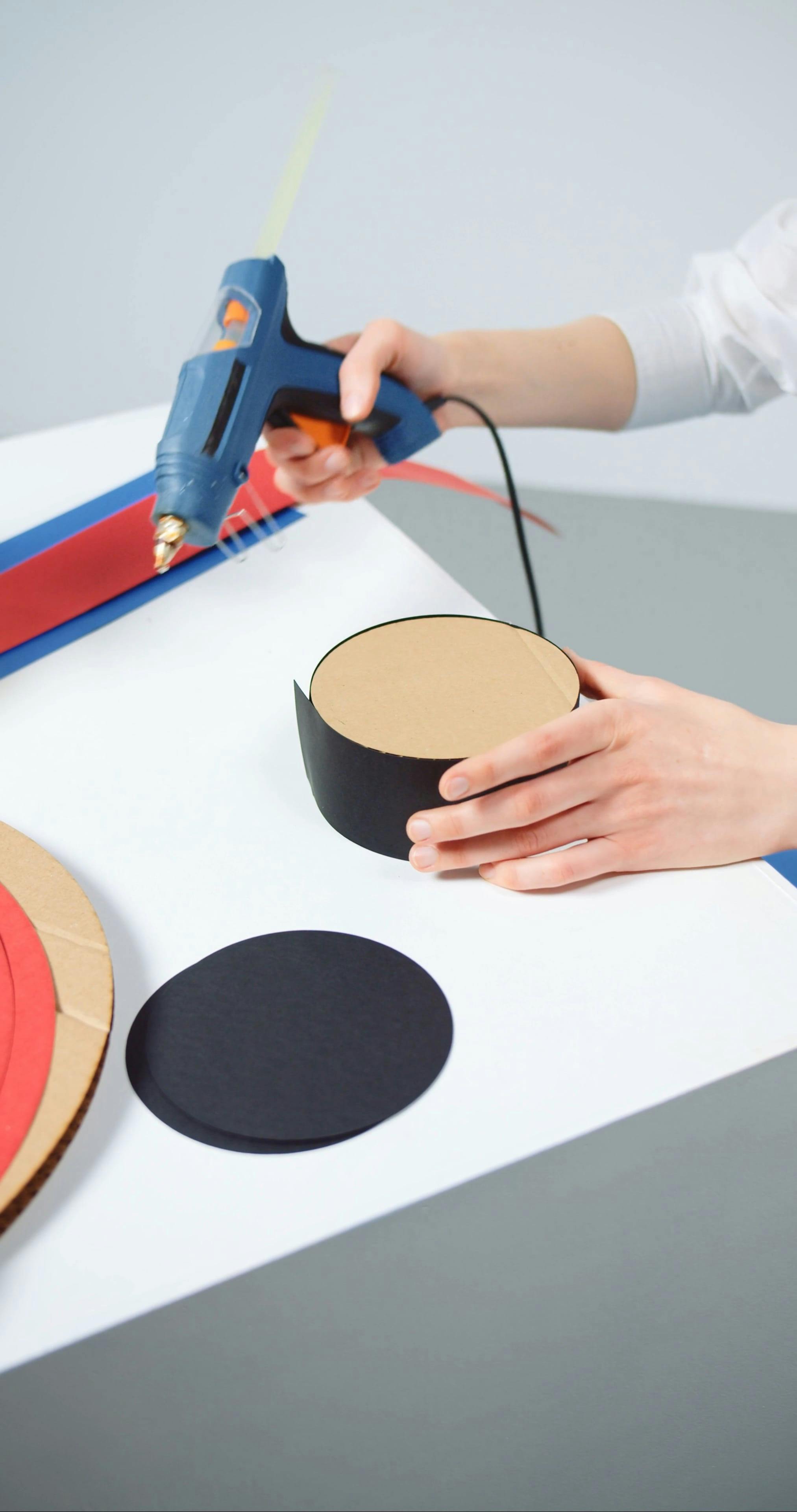 A Woman Covering The Cardboard With Colored Paper Free Stock Video ...