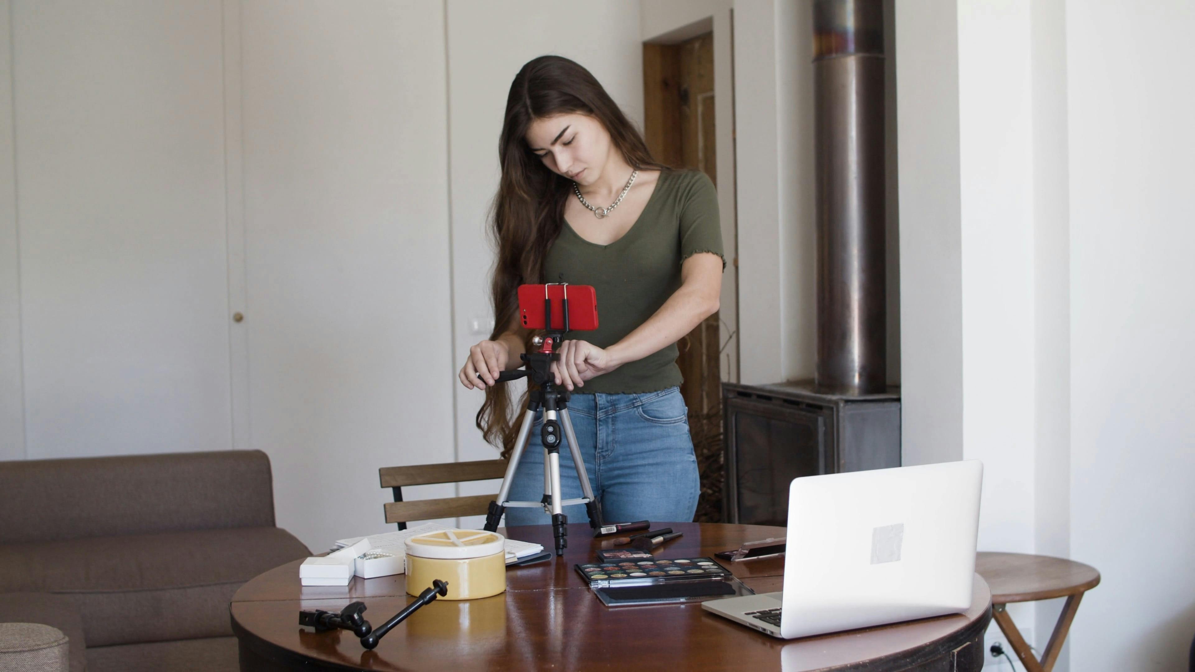 Woman Setting Up a Smartphone on a Tripod Free Stock Video Footage ...