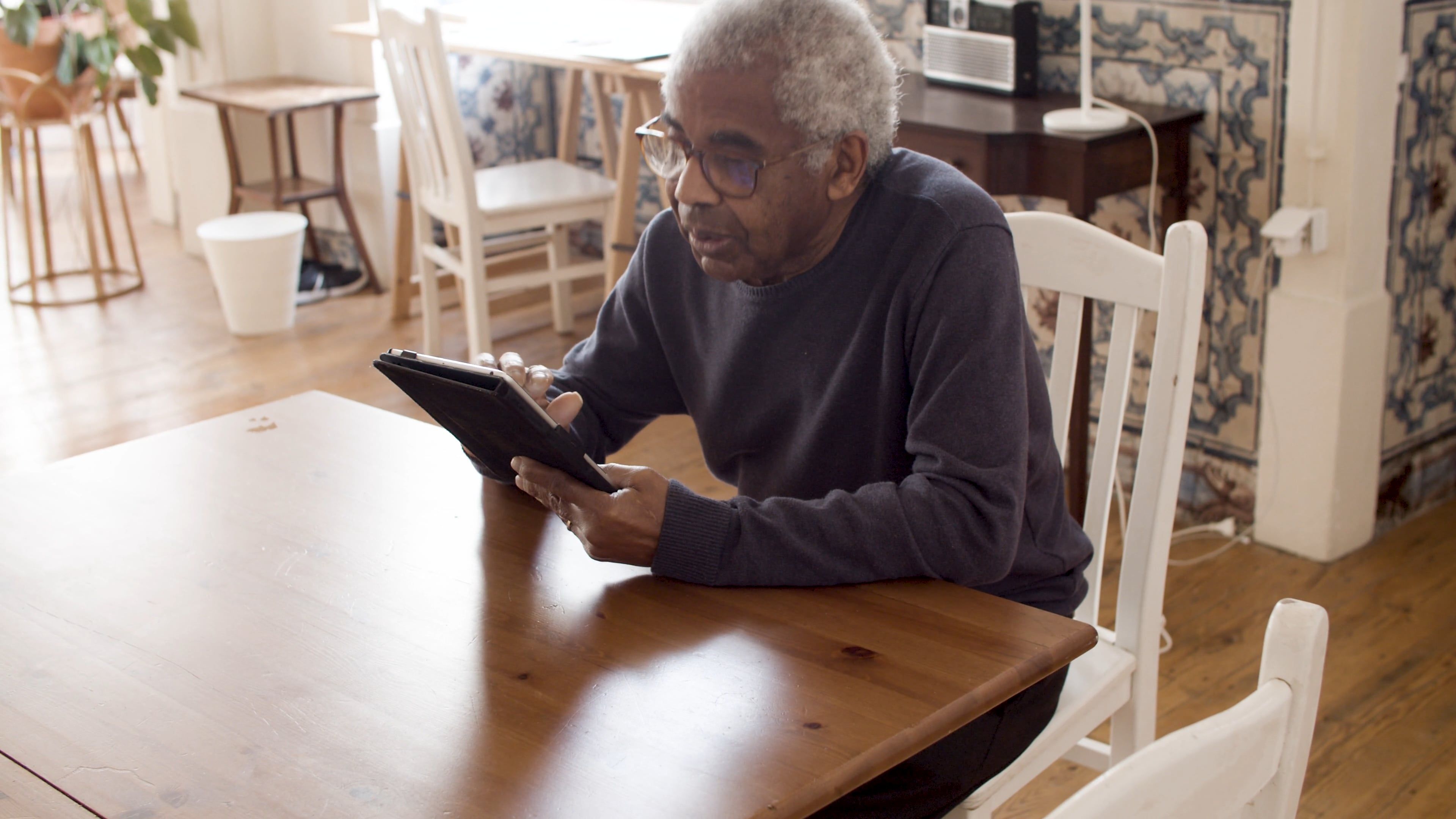 Elderly Man Using Digital tablet · Free Stock Video