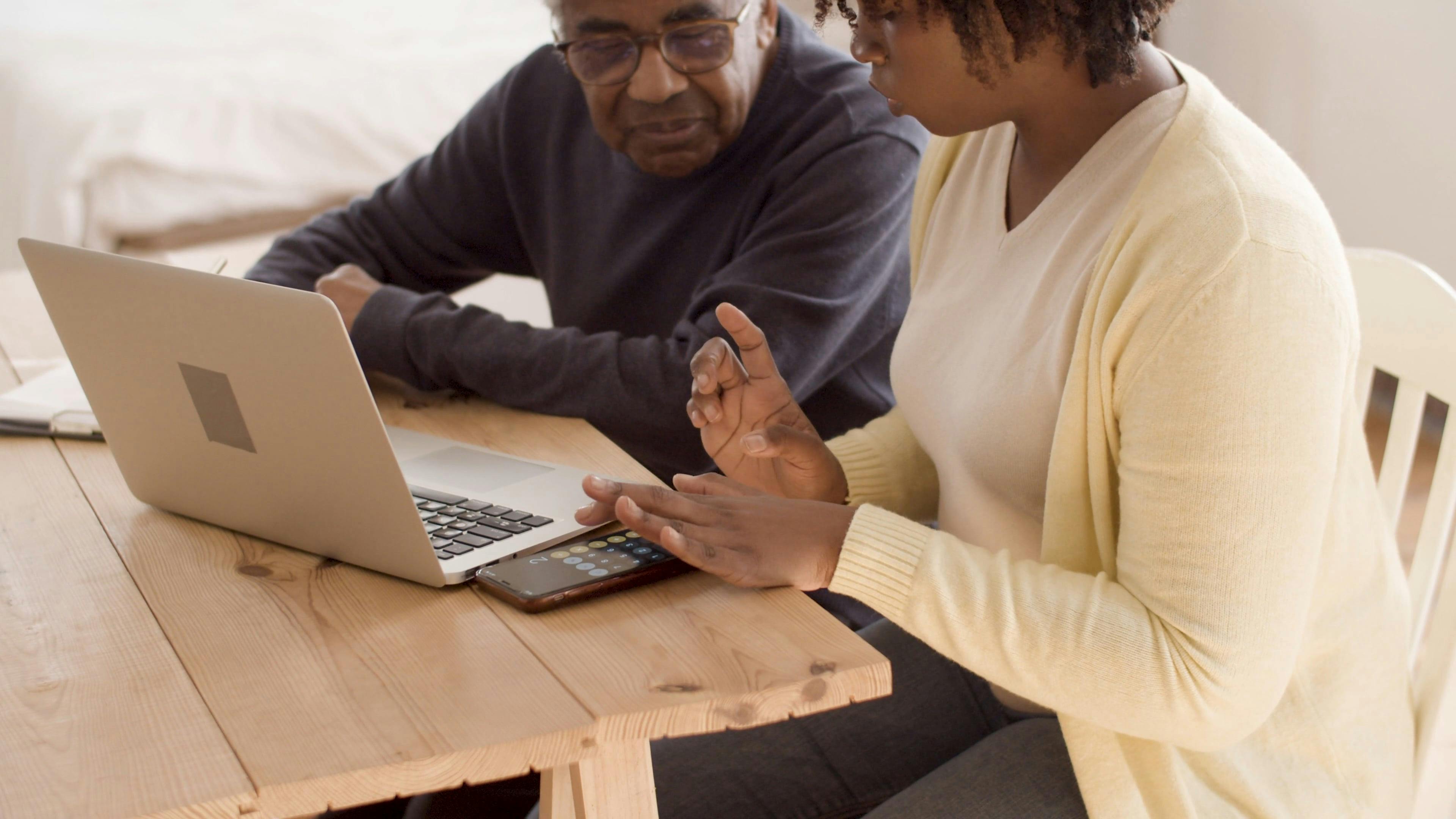 A Woman Using Laptop while Talking · Free Stock Video