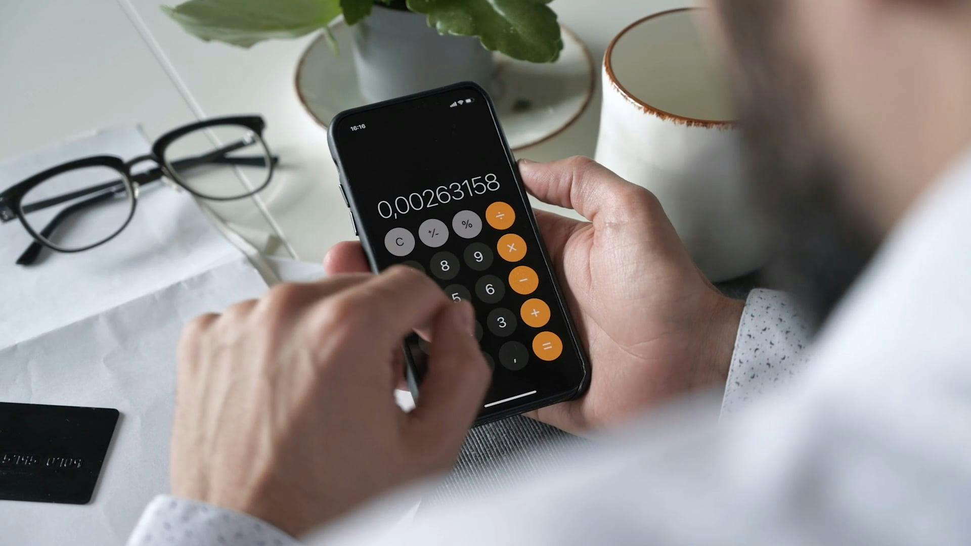 Person Using A Calculator · Free Stock Video