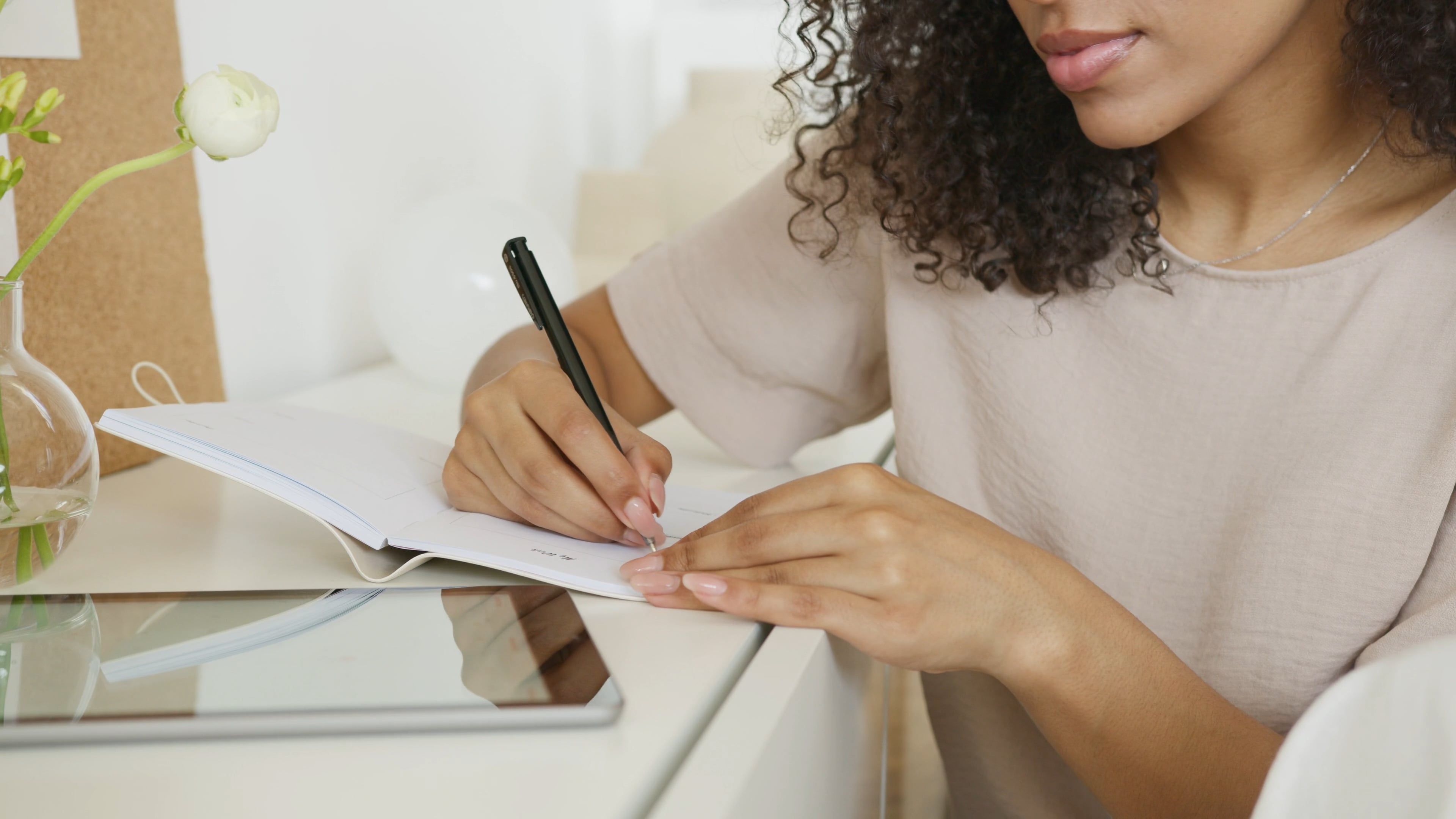 Woman Writing on a Notebook · Free Stock Video