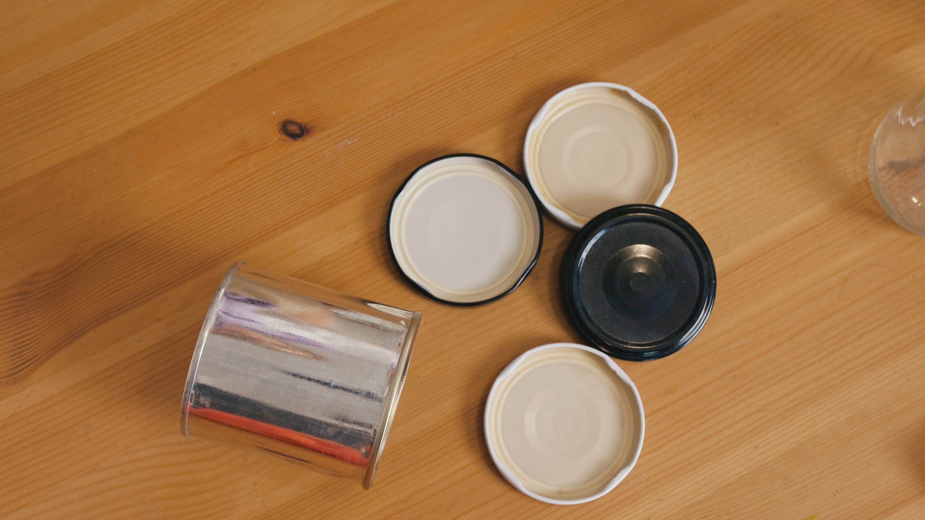 Close up Shot of Metal Can and Bottle Caps · Free Stock Video