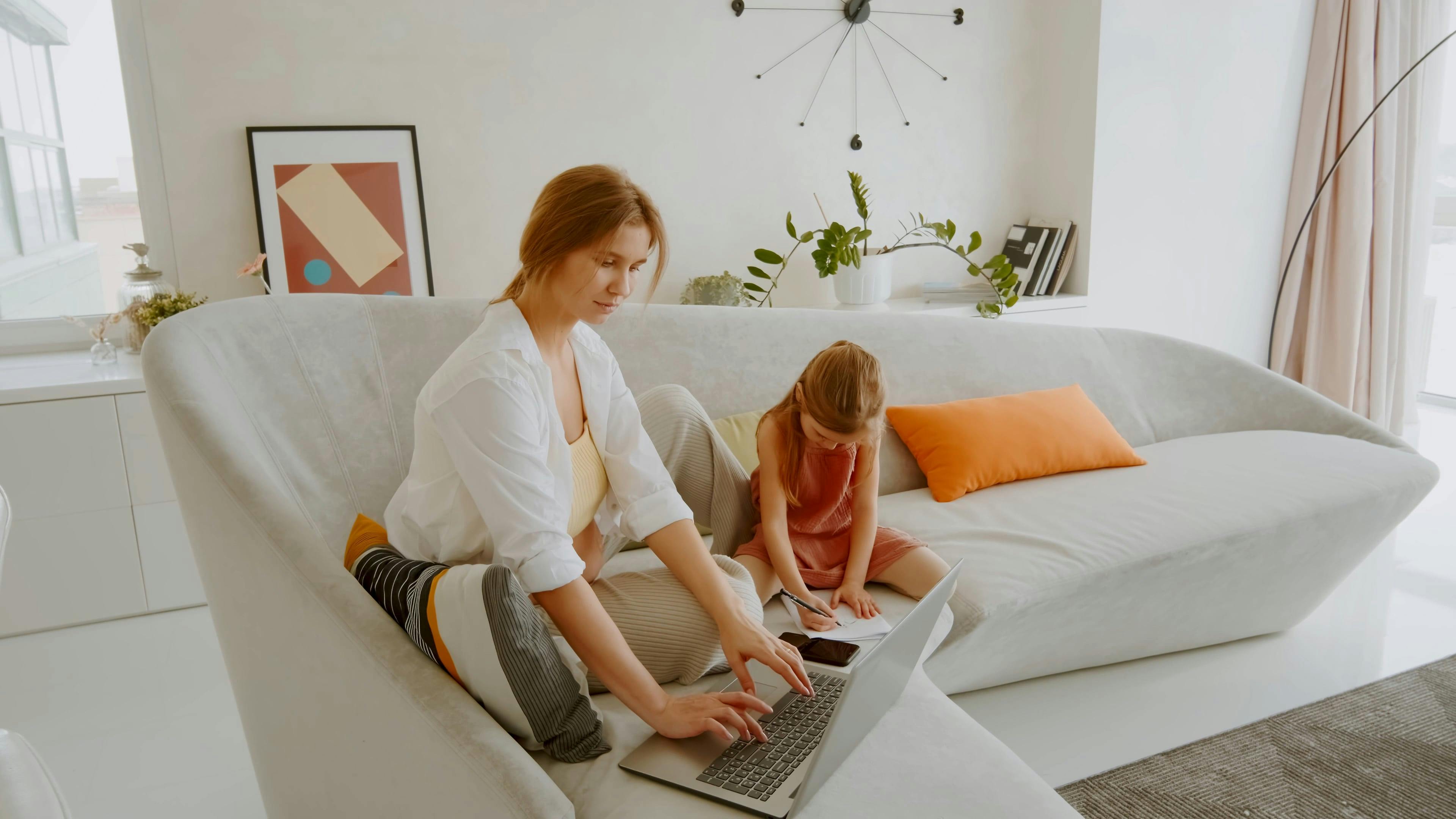 Mother And Daughter Sitting On The Couch · Free Stock Video