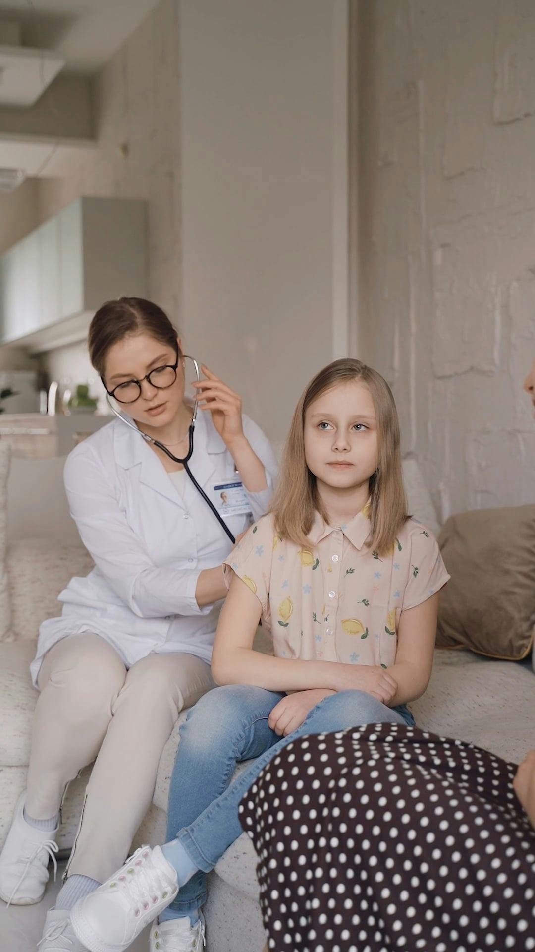 A Female Doctor Talking to a Patient and her Mother · Free Stock Video