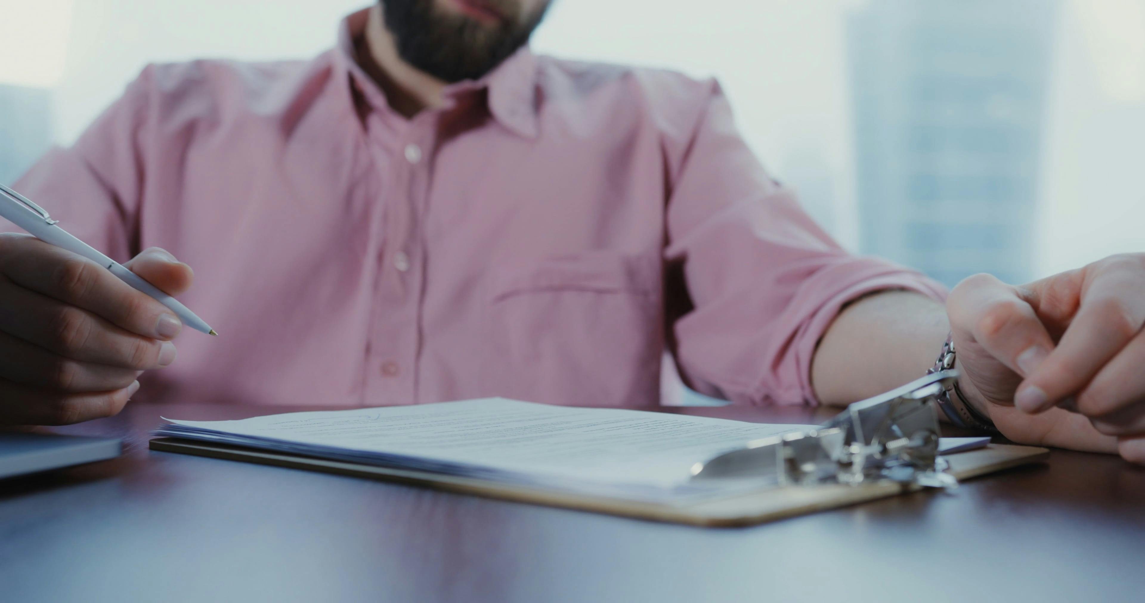 Man Signing the Paper · Free Stock Video