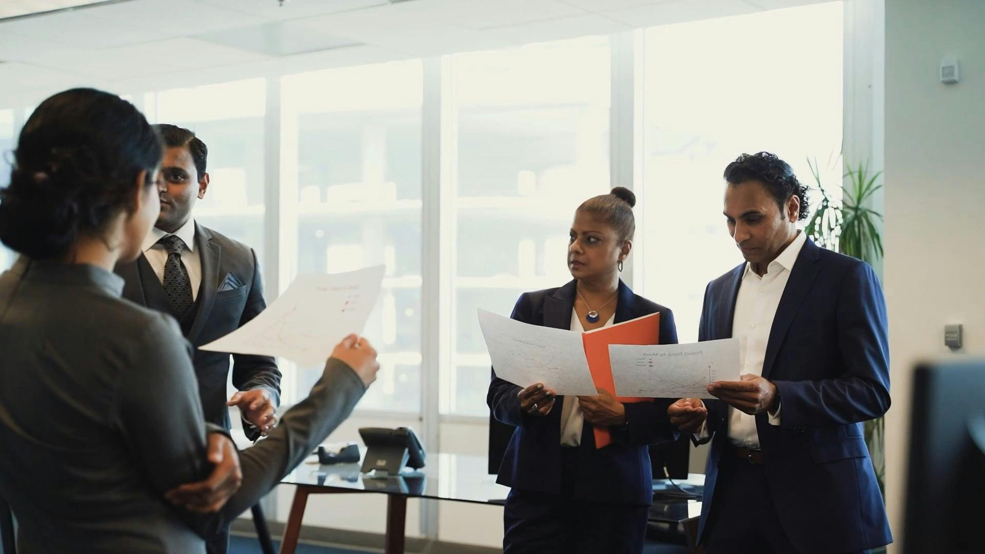 Workmates Discussing A Graphic At The Office Free Stock Video Footage ...