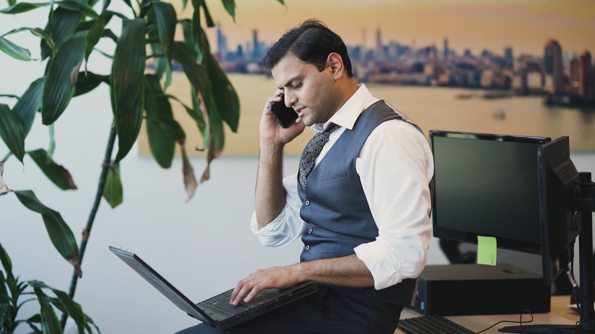 Man Working on His Laptop while Talking on the Phone Free Stock Video ...