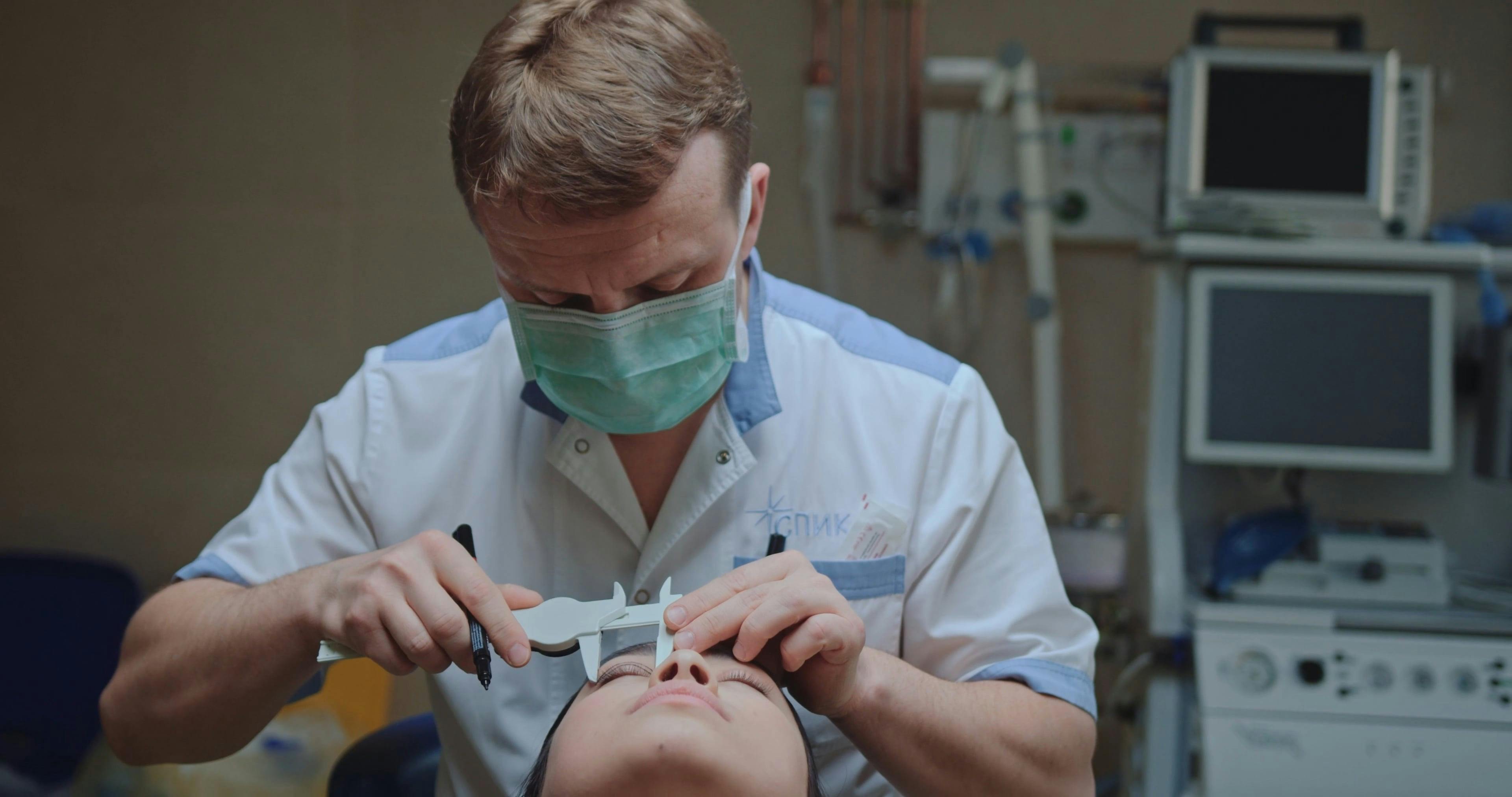 Man Measuring Woman's Eyelids Using a Caliper · Free Stock Video