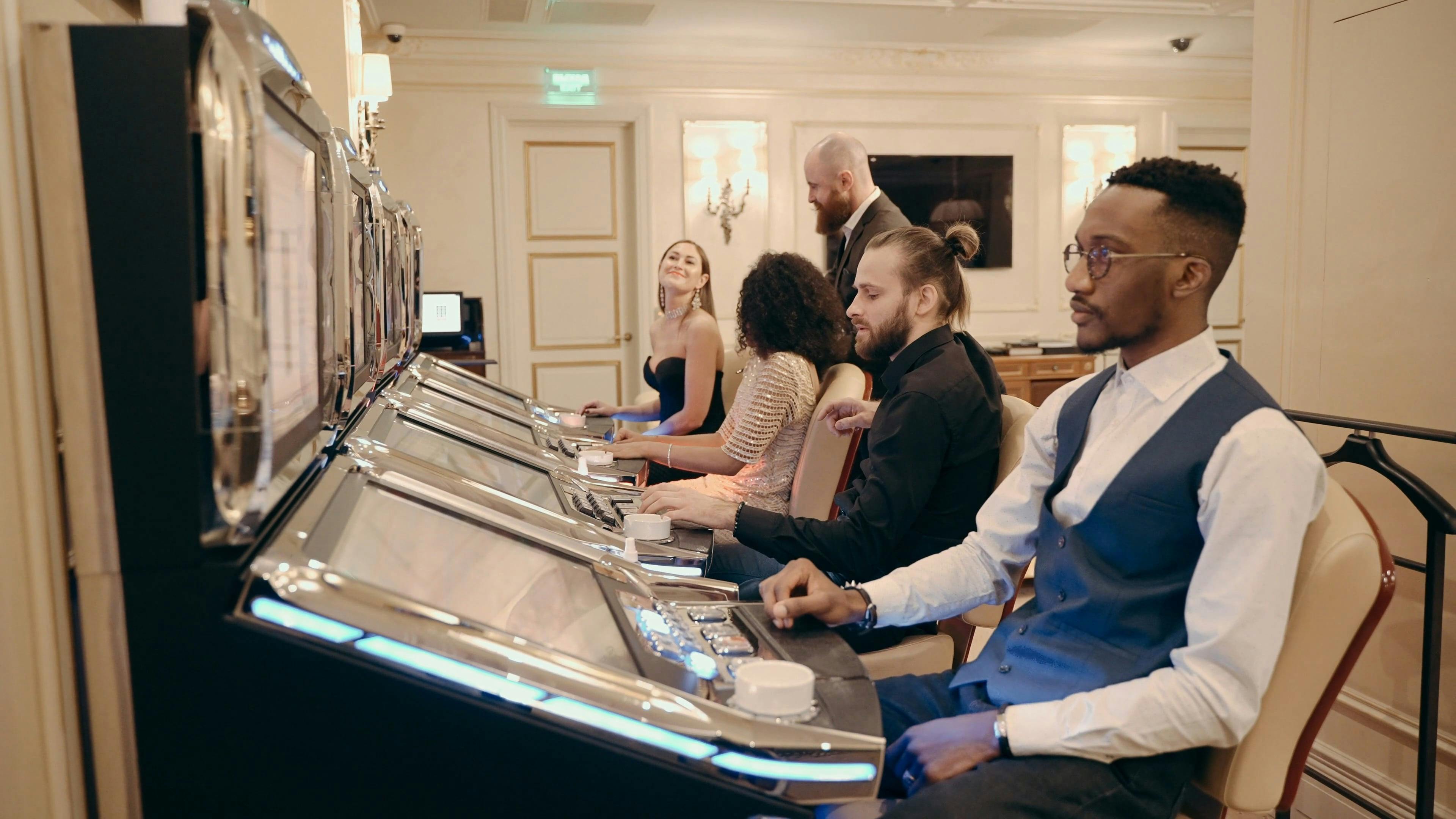 Side View of People Playing the Slot Machines · Free Stock Video