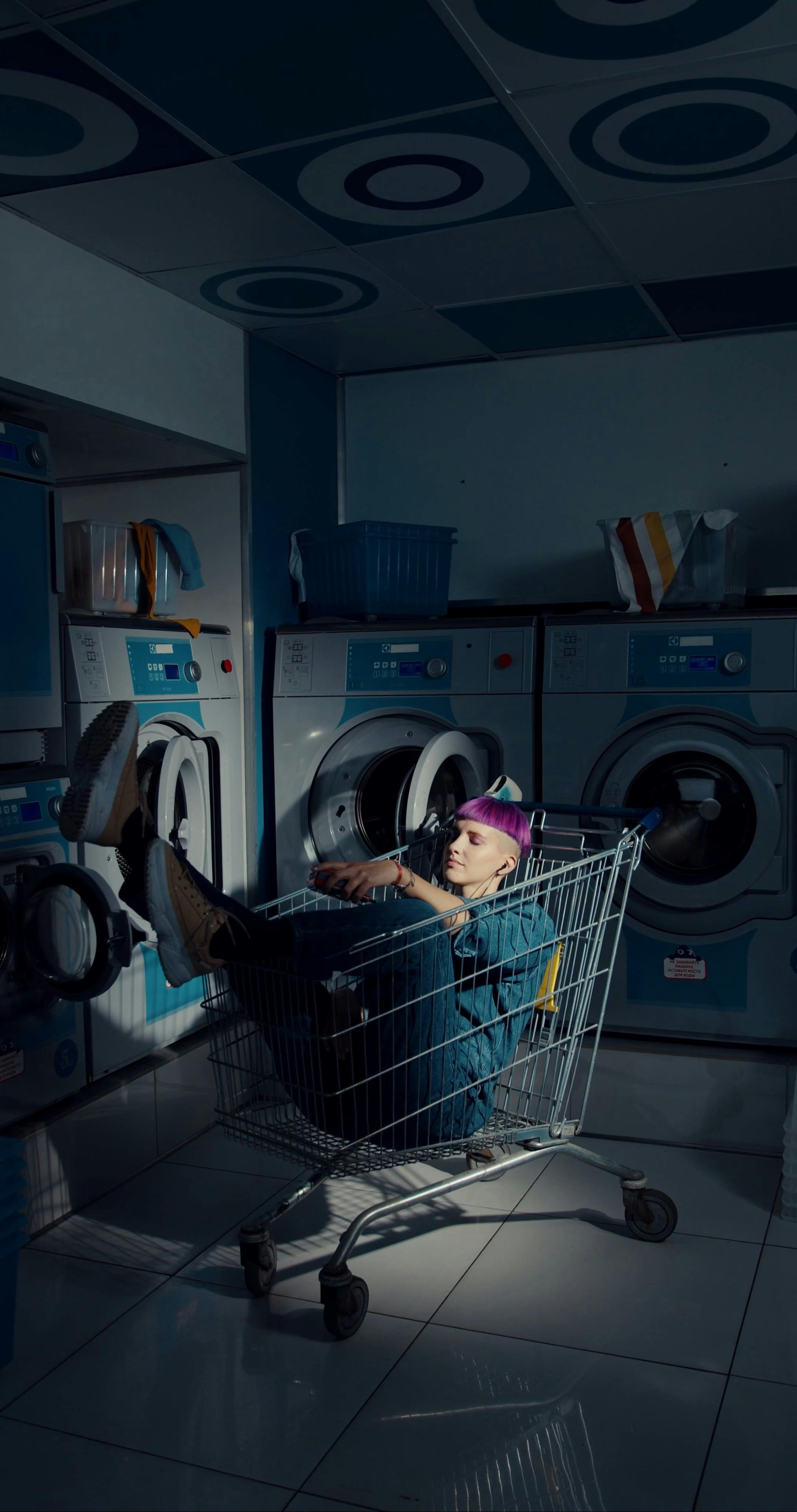 Woman Inside a Shopping Cart Listening to Music · Free Stock Video