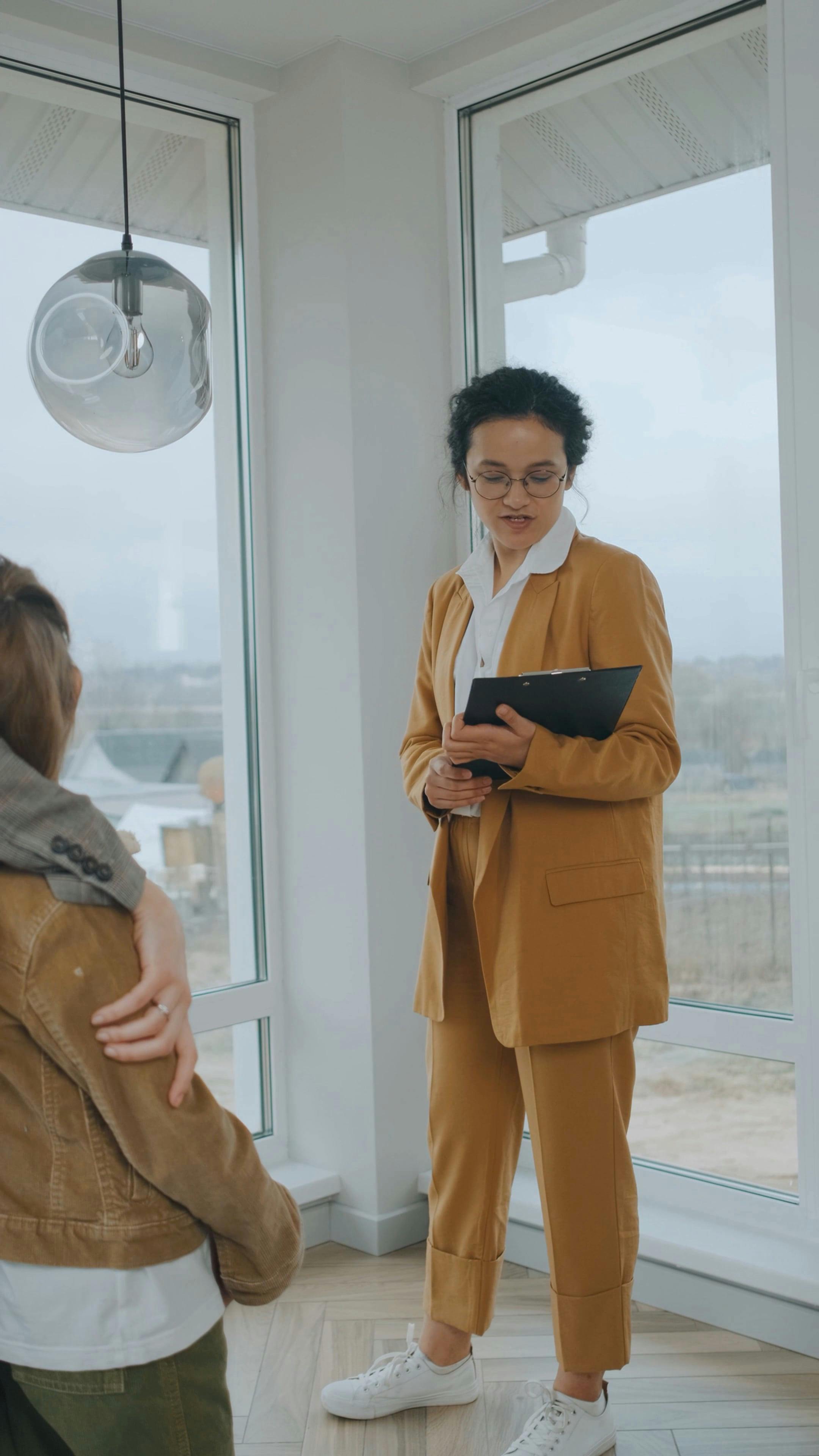 A Realtor Showing the Couple Around the House · Free Stock Video