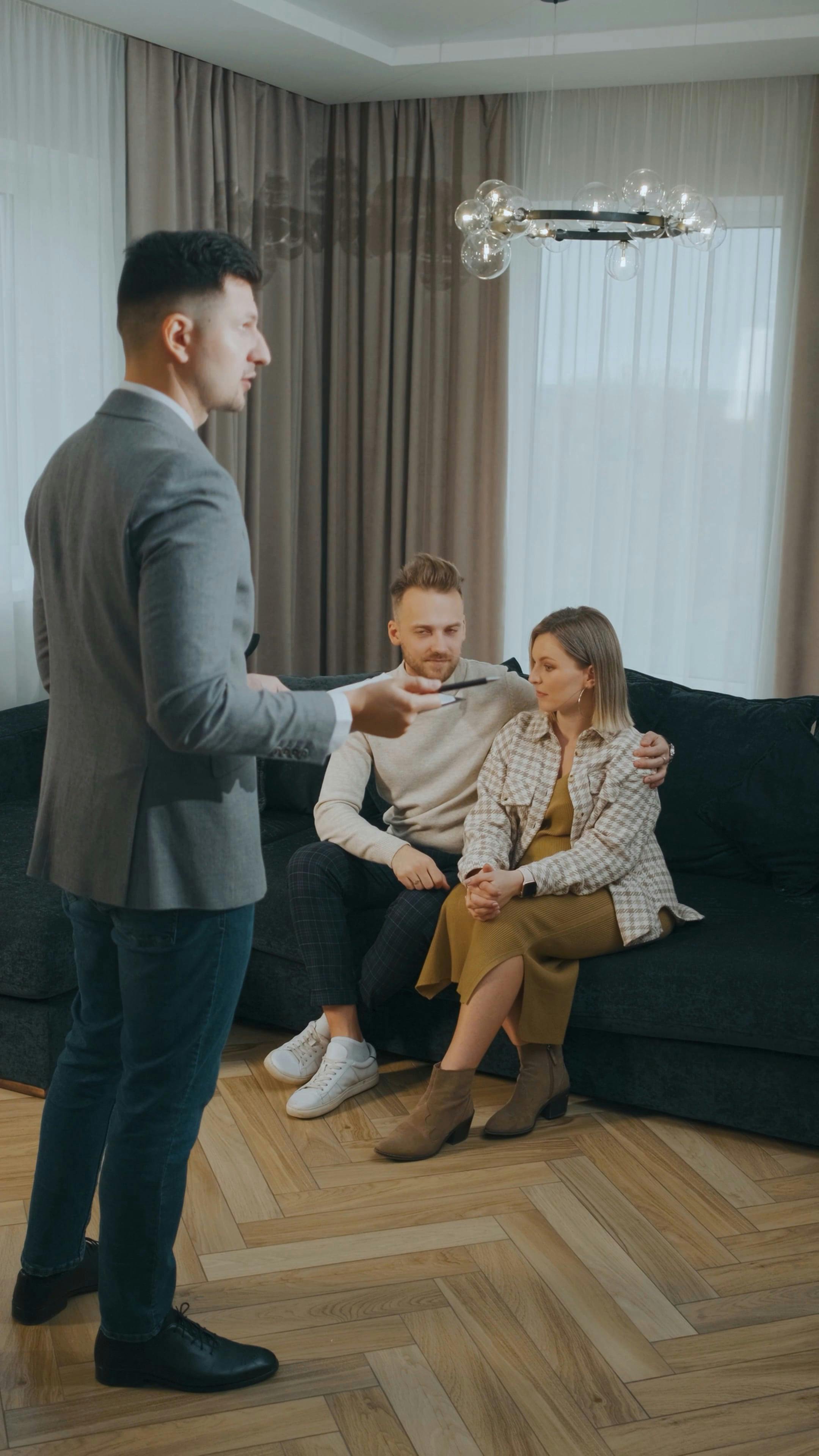 A Realtor Showing a House to a Couple · Free Stock Video