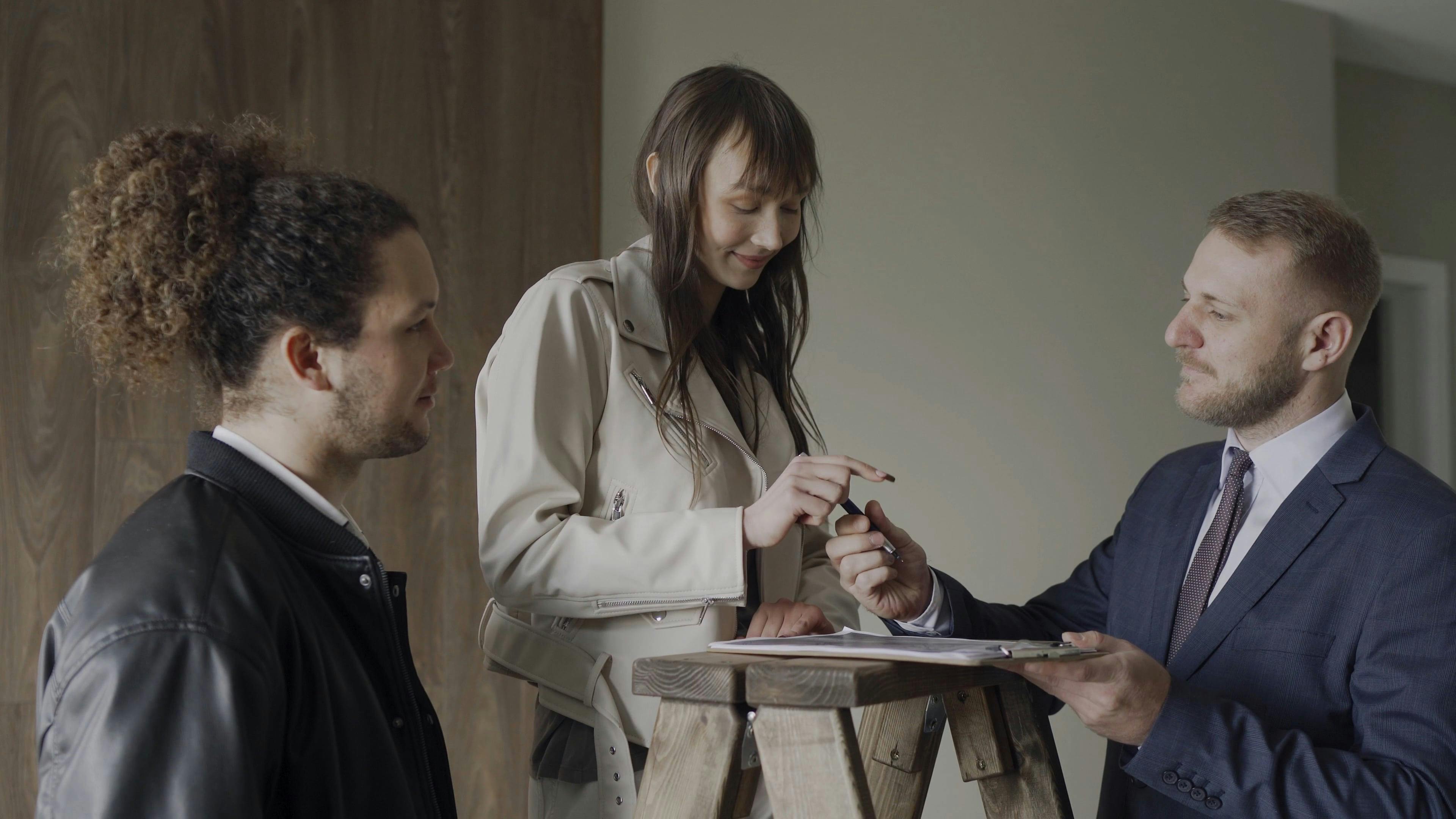 Real Estate Agent Explaining to His Clients Free Stock Video Footage ...