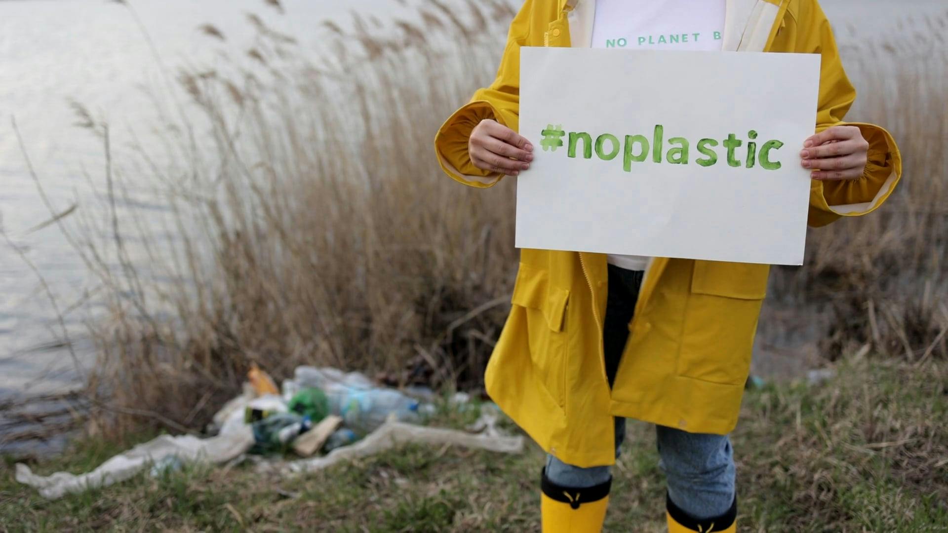 Person Holding a Sign Against Plastic Use · Free Stock Video