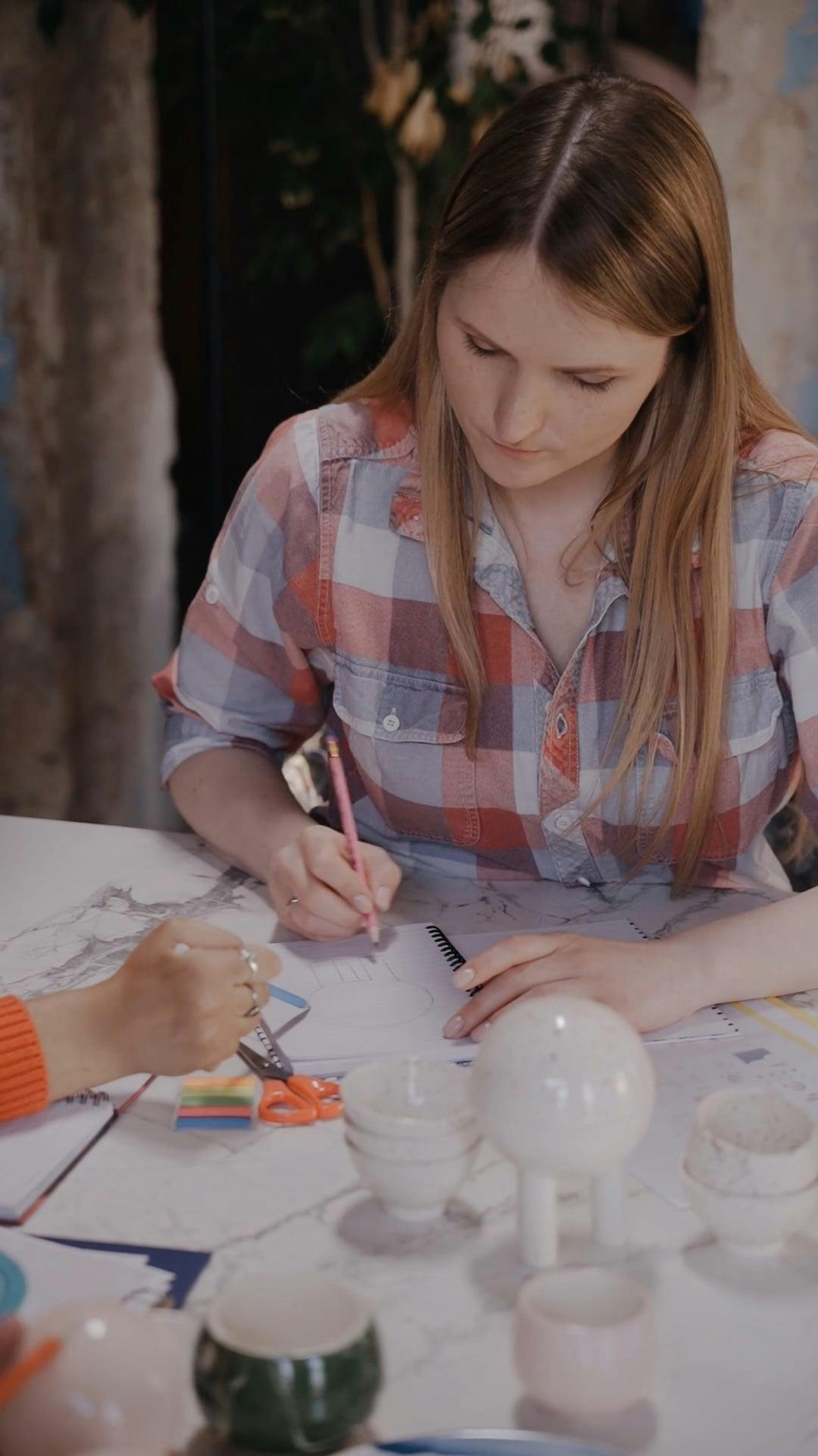 Woman Drawing on Notebook · Free Stock Video