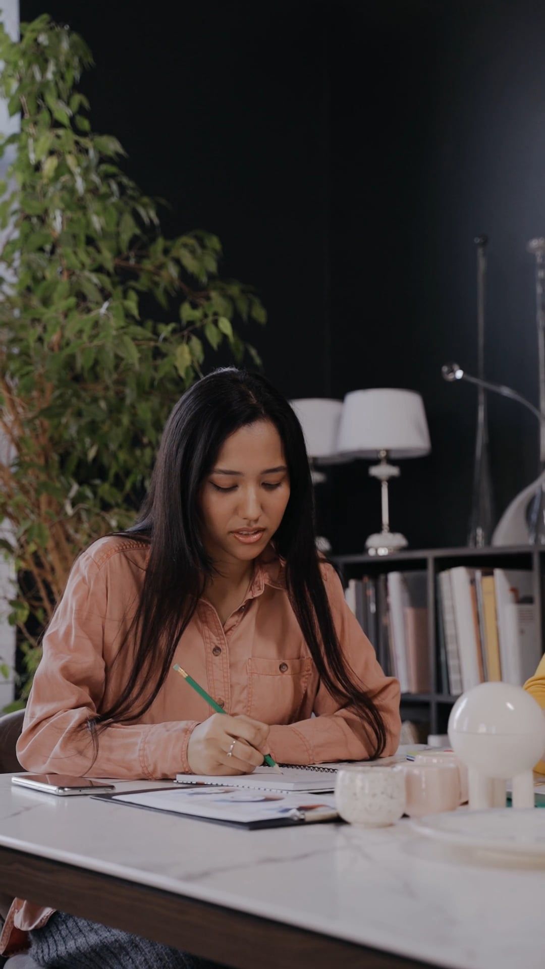 Woman Drawing on Notebook · Free Stock Video