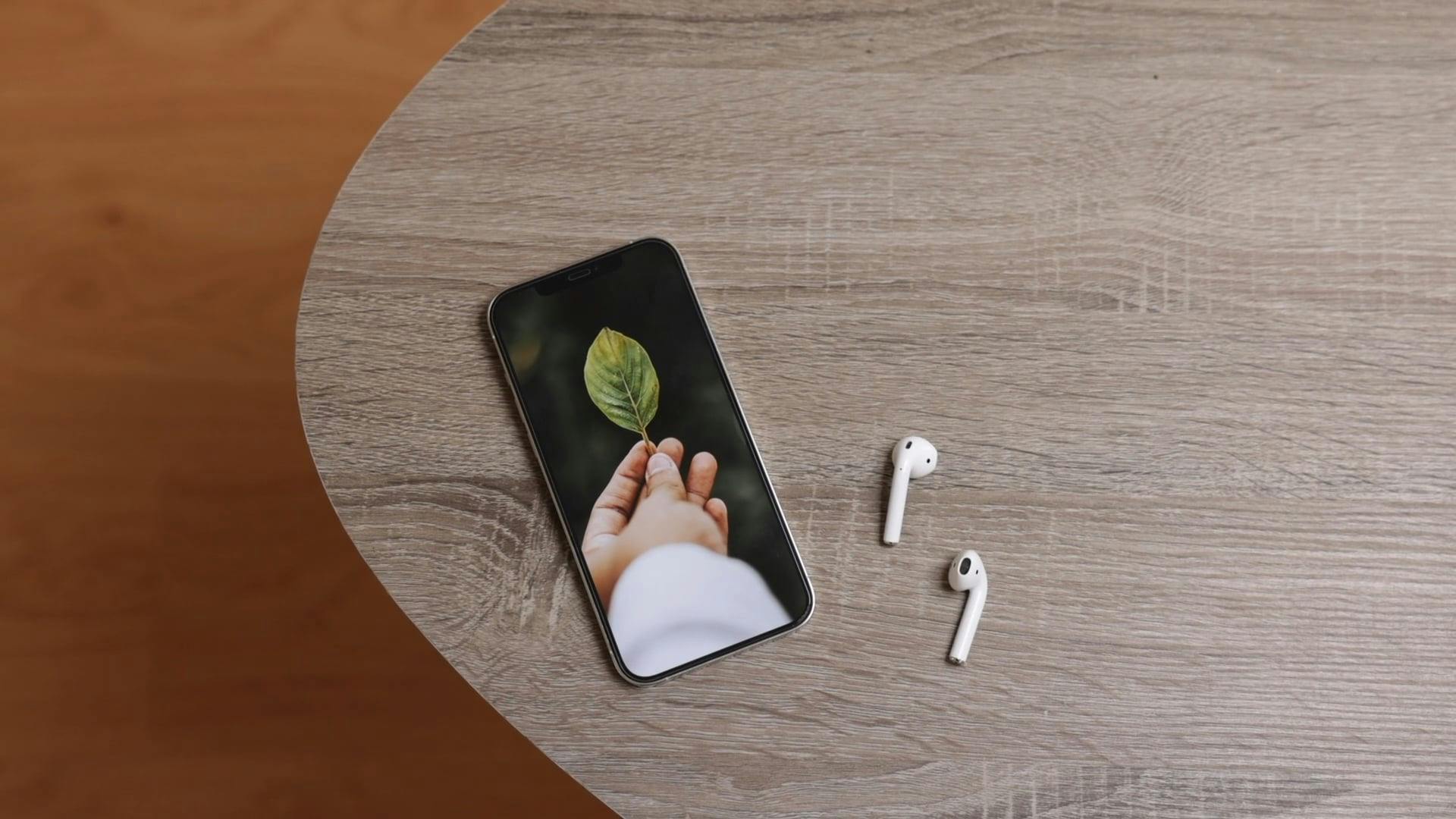 A Person Get Earpods on the Table · Free Stock Video