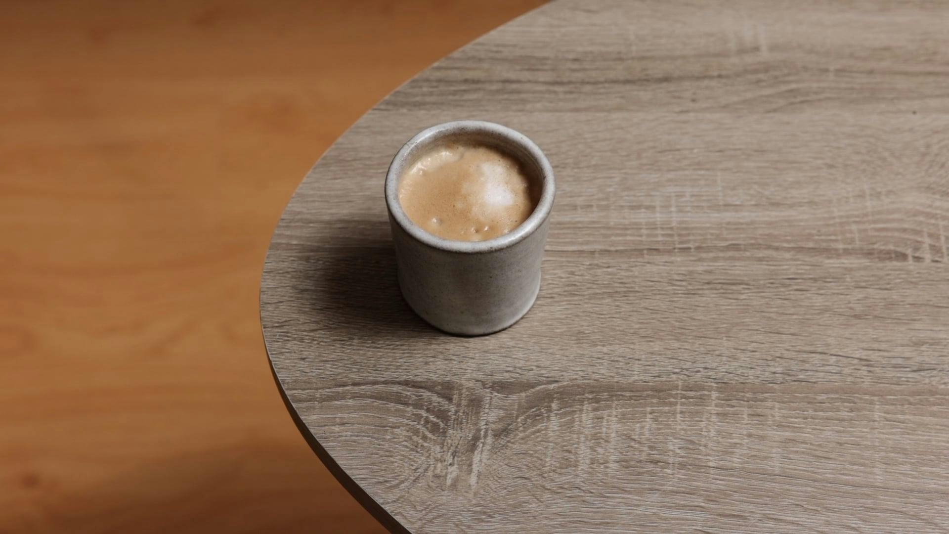 A Person Placing the Cup of Coffee on the Table · Free Stock Video