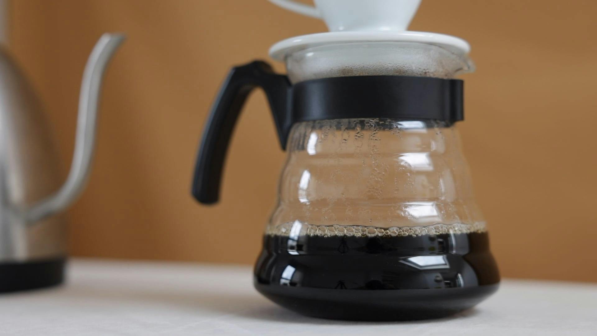 Coffee Dripping in a Container while using Coffee Filter · Free Stock Video
