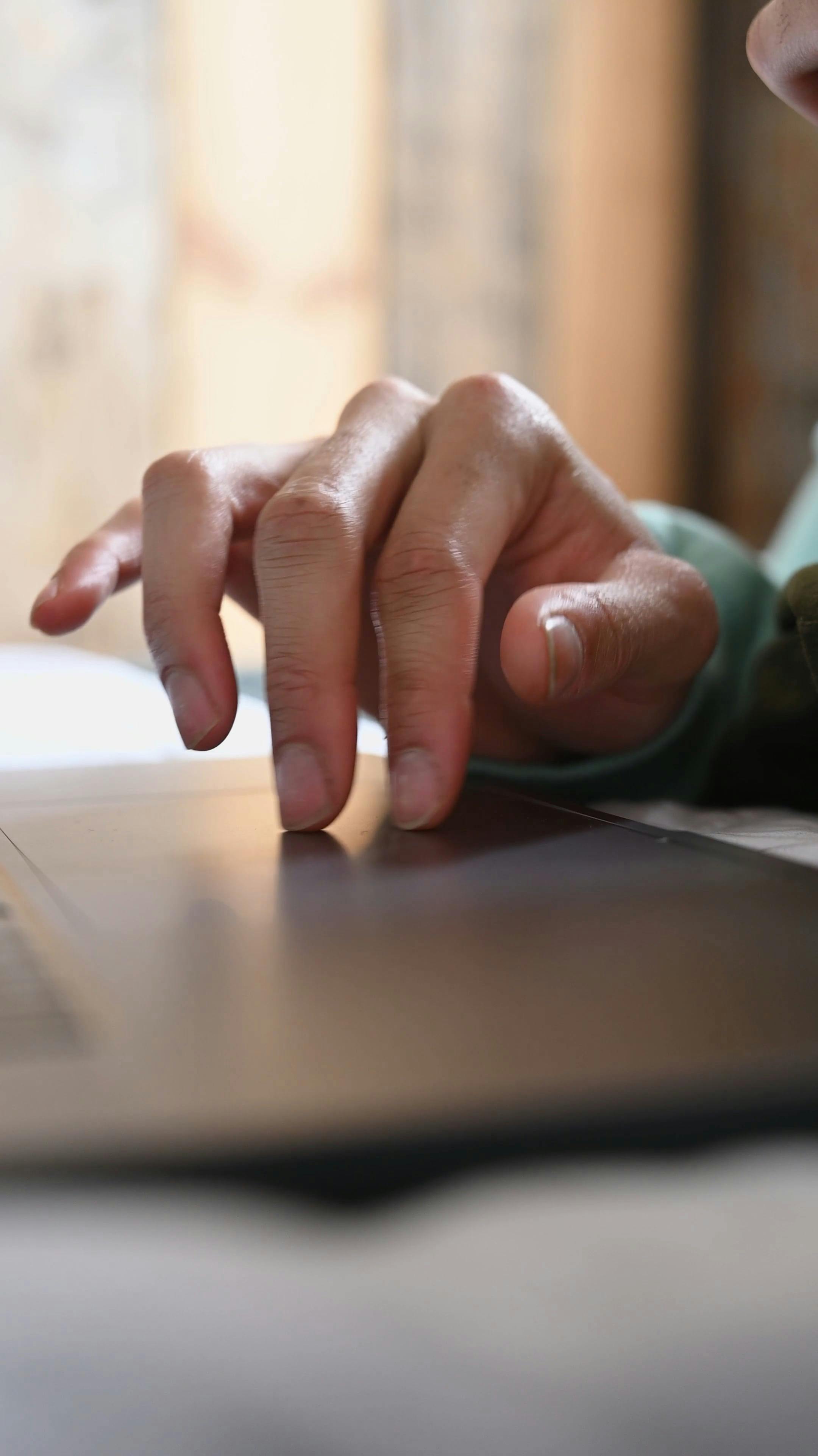 Close-Up View of a Person Scrolling through a Smartphone · Free Stock Video