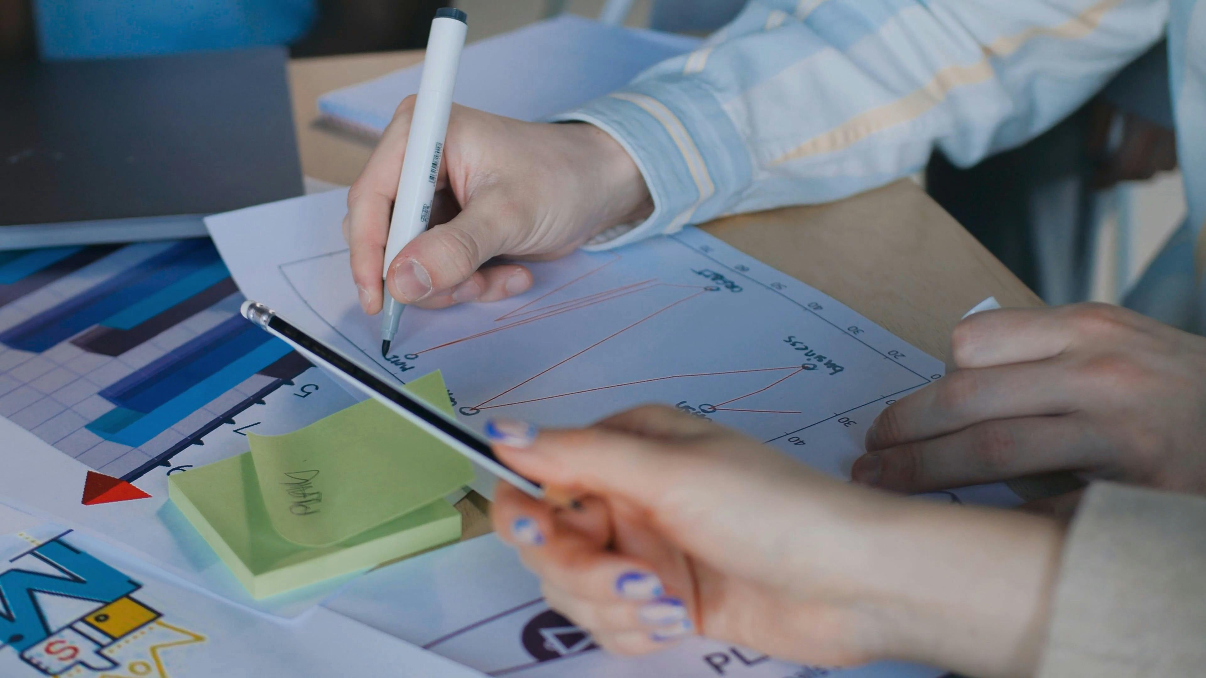 A Person Labelling a Graph · Free Stock Video