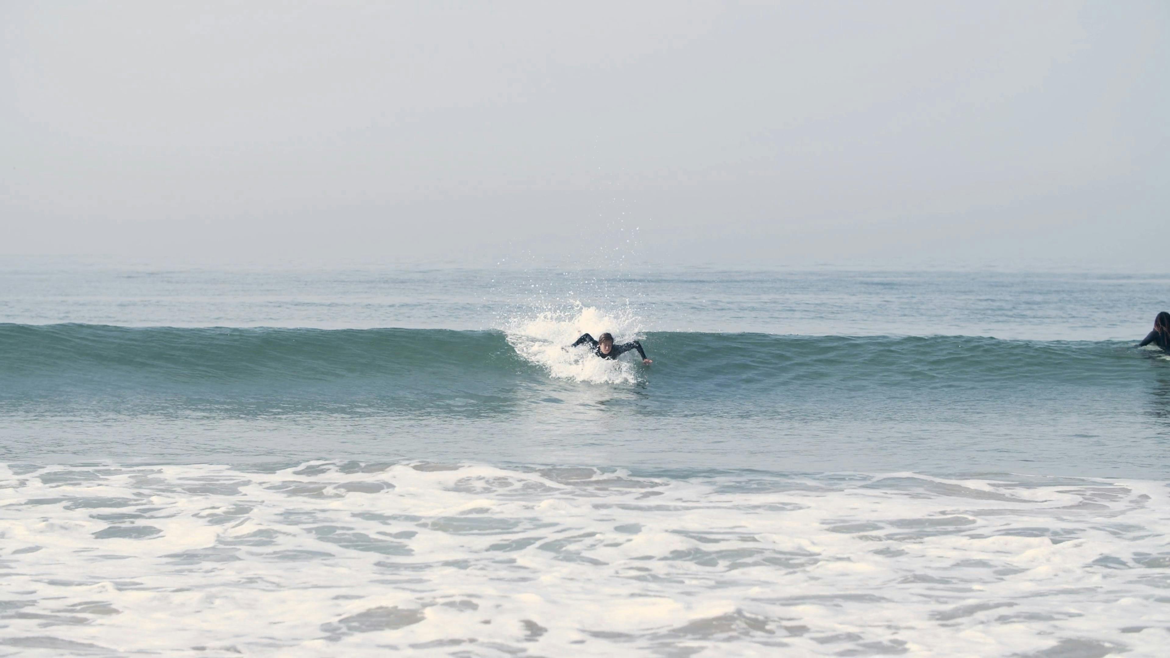 A Surfer Riding the Waves · Free Stock Video