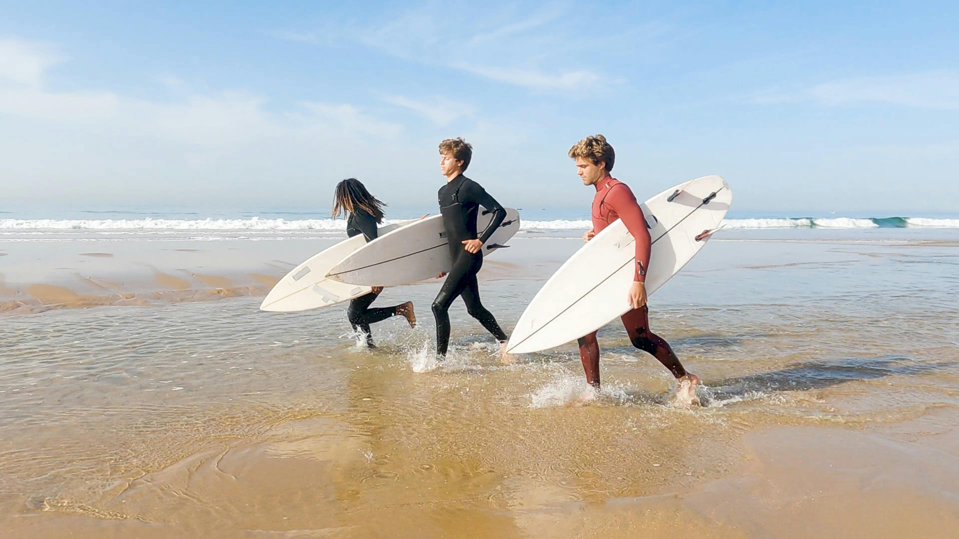 Surfers Running on the Beach · Free Stock Video