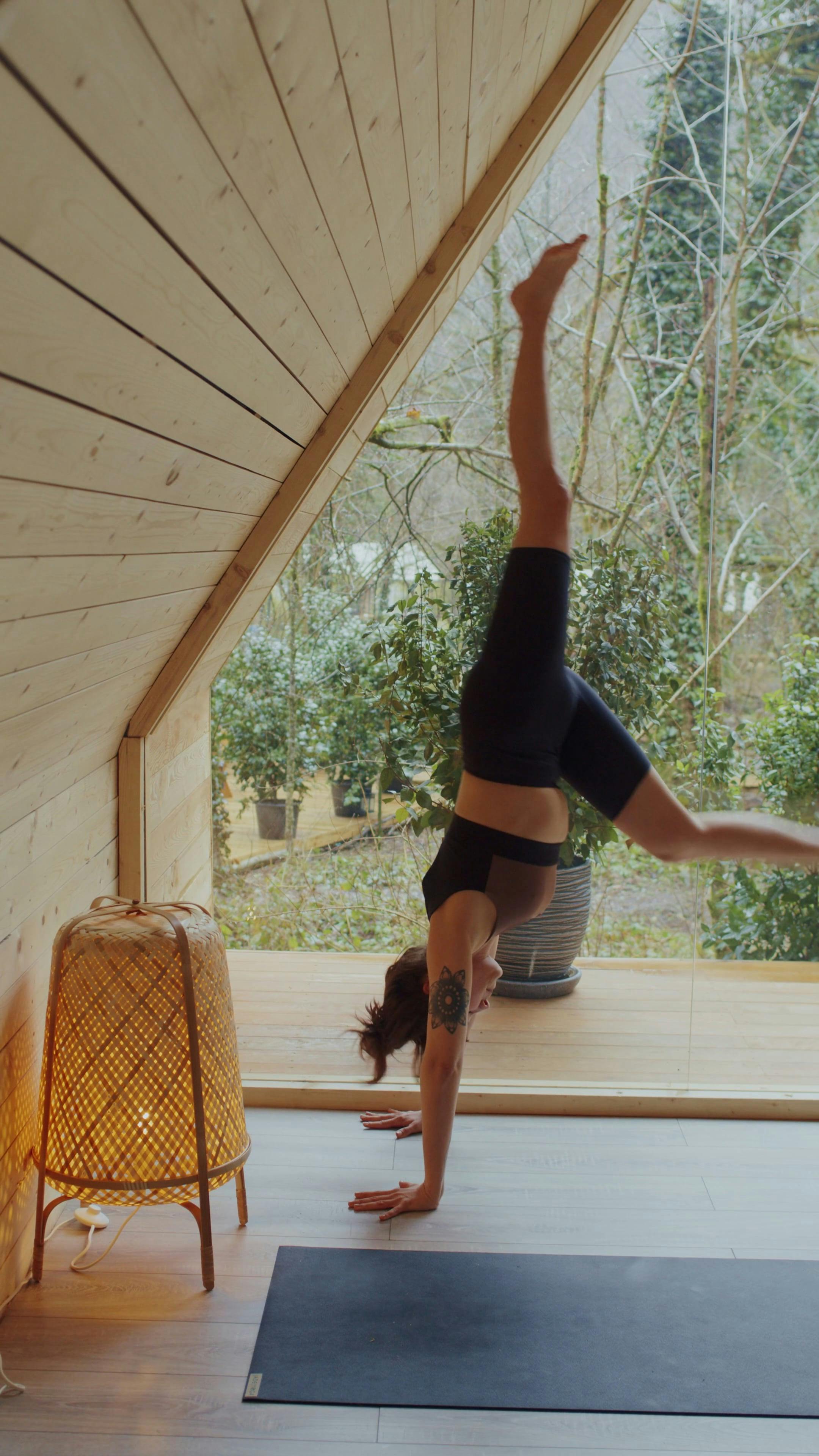 A Woman Meditating On A Platform Overseeing The Rice Field · Free Stock ...