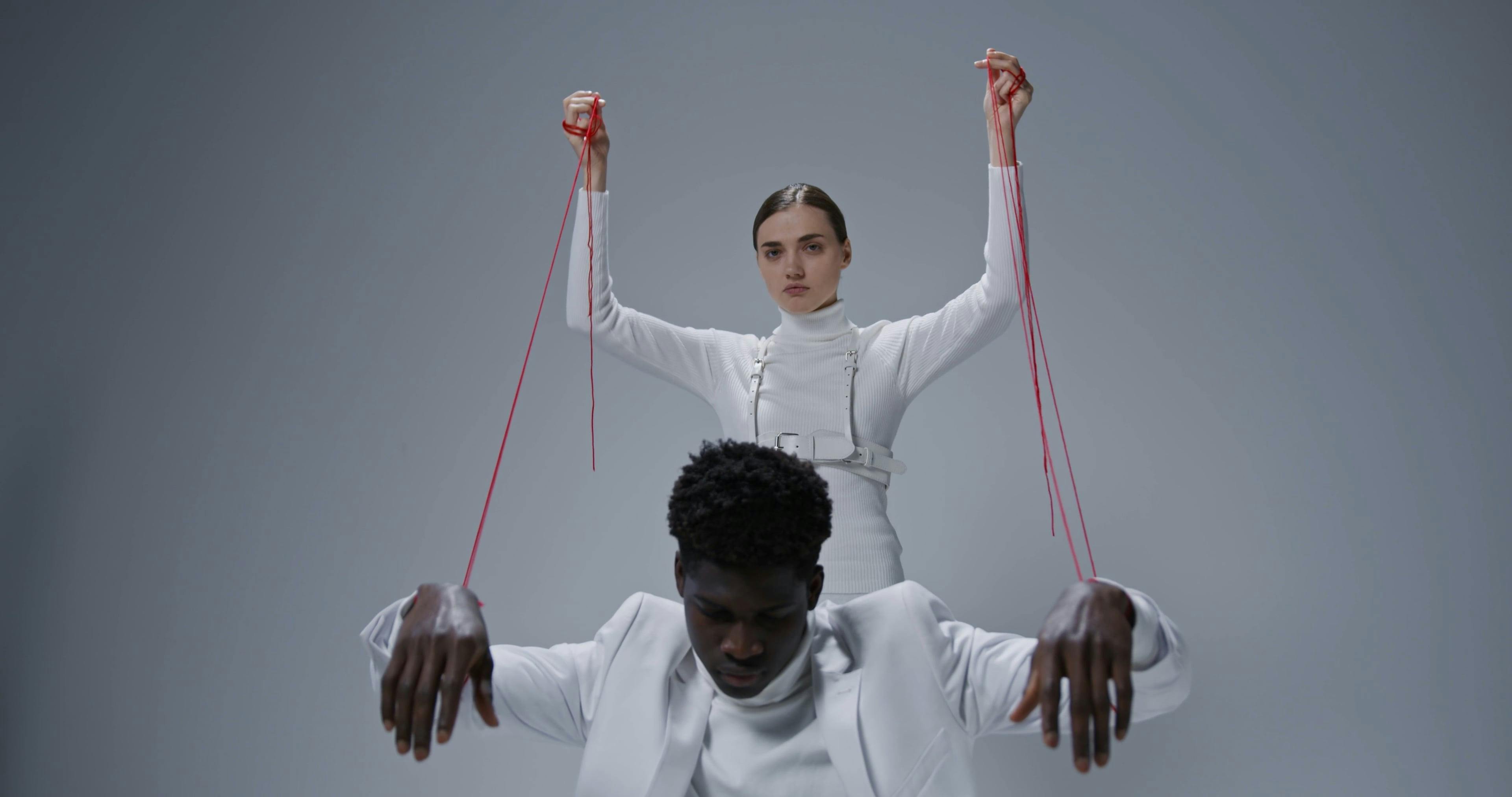 Man and Woman Tied With Threads · Free Stock Video