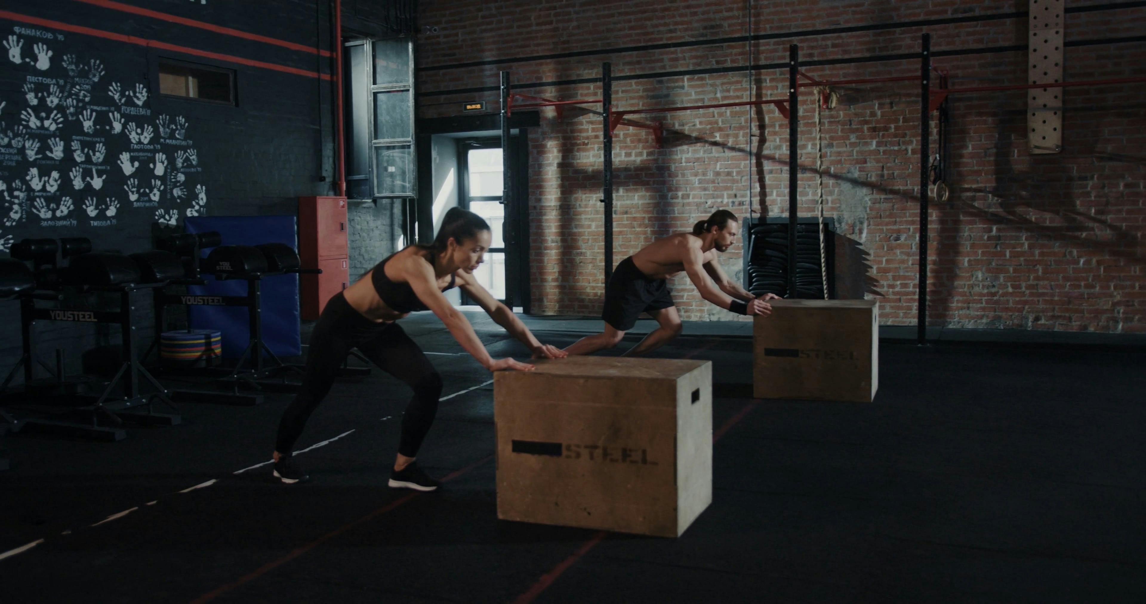 A Man And A Woman Pushing A Wood Box Free Stock Video Footage, Royalty ...