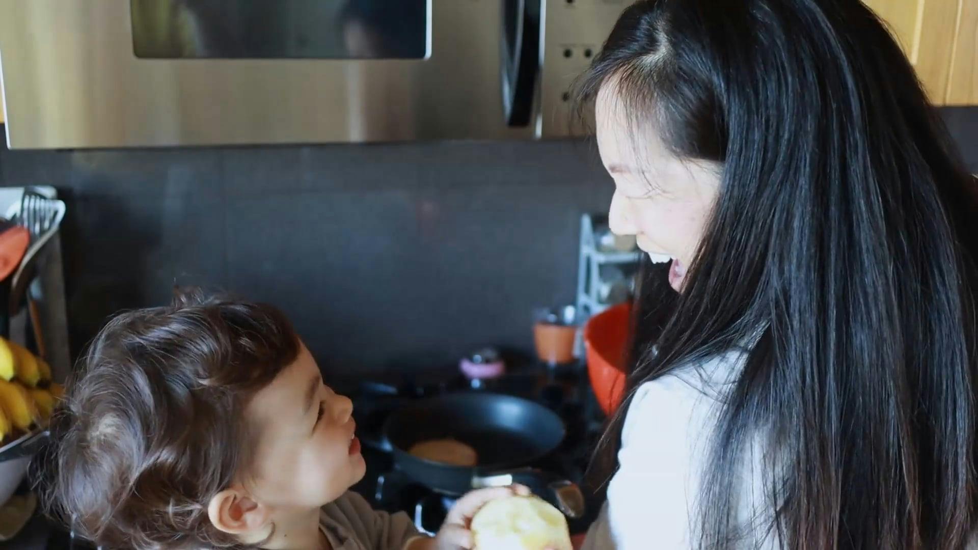 A Mother Cooking Pancake With Her Child Free Stock Video Footage ...