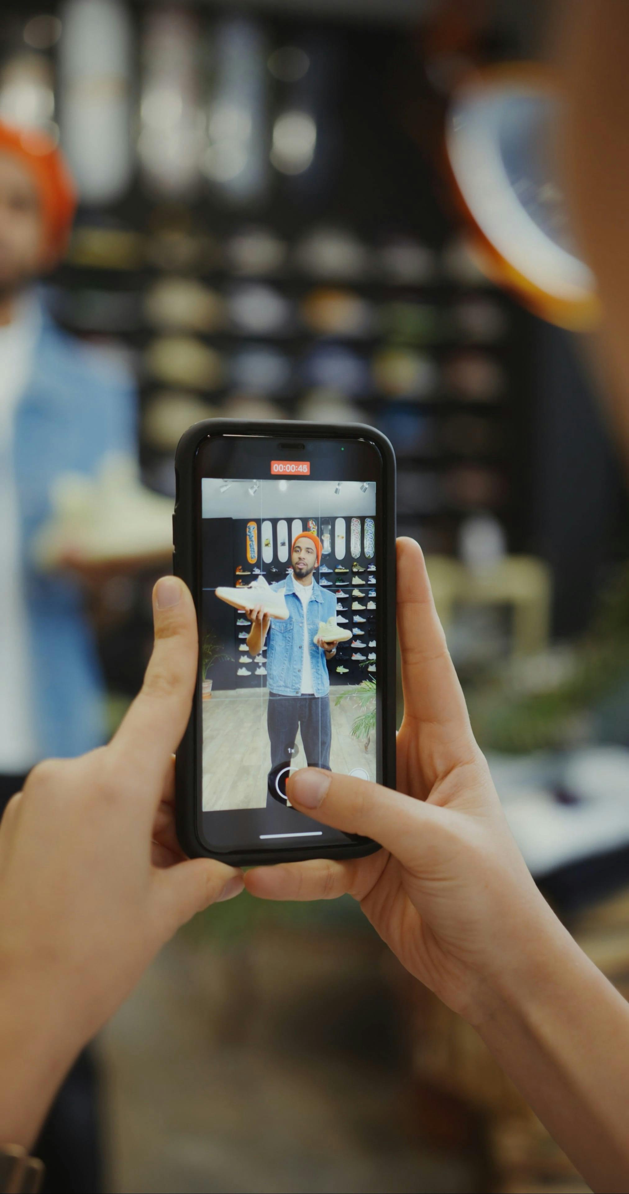 Taking Video of Man Showcasing a Pair of Shoes · Free Stock Video