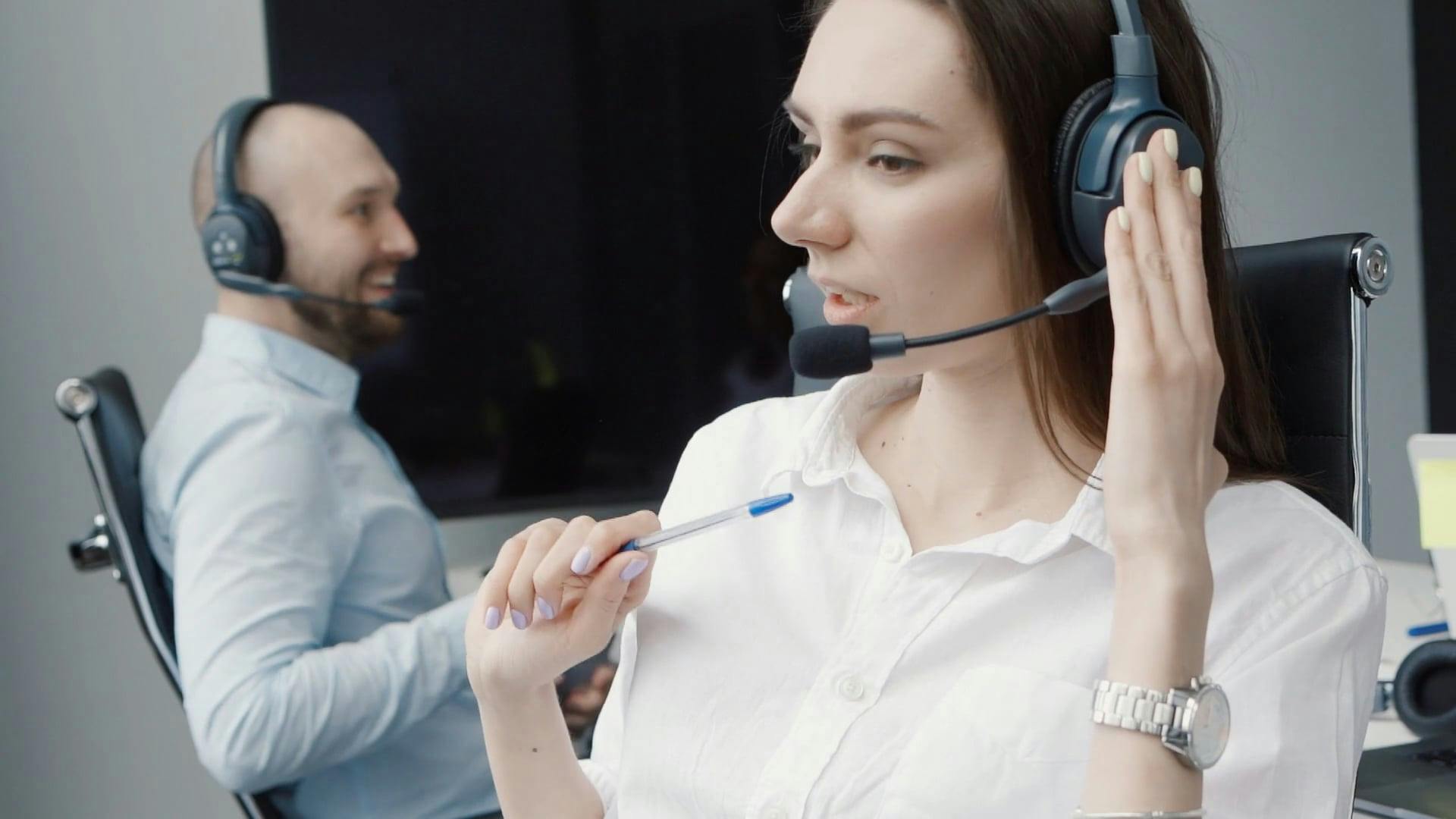 Call Center Agents Talking to Customers while Sitting · Free Stock Video